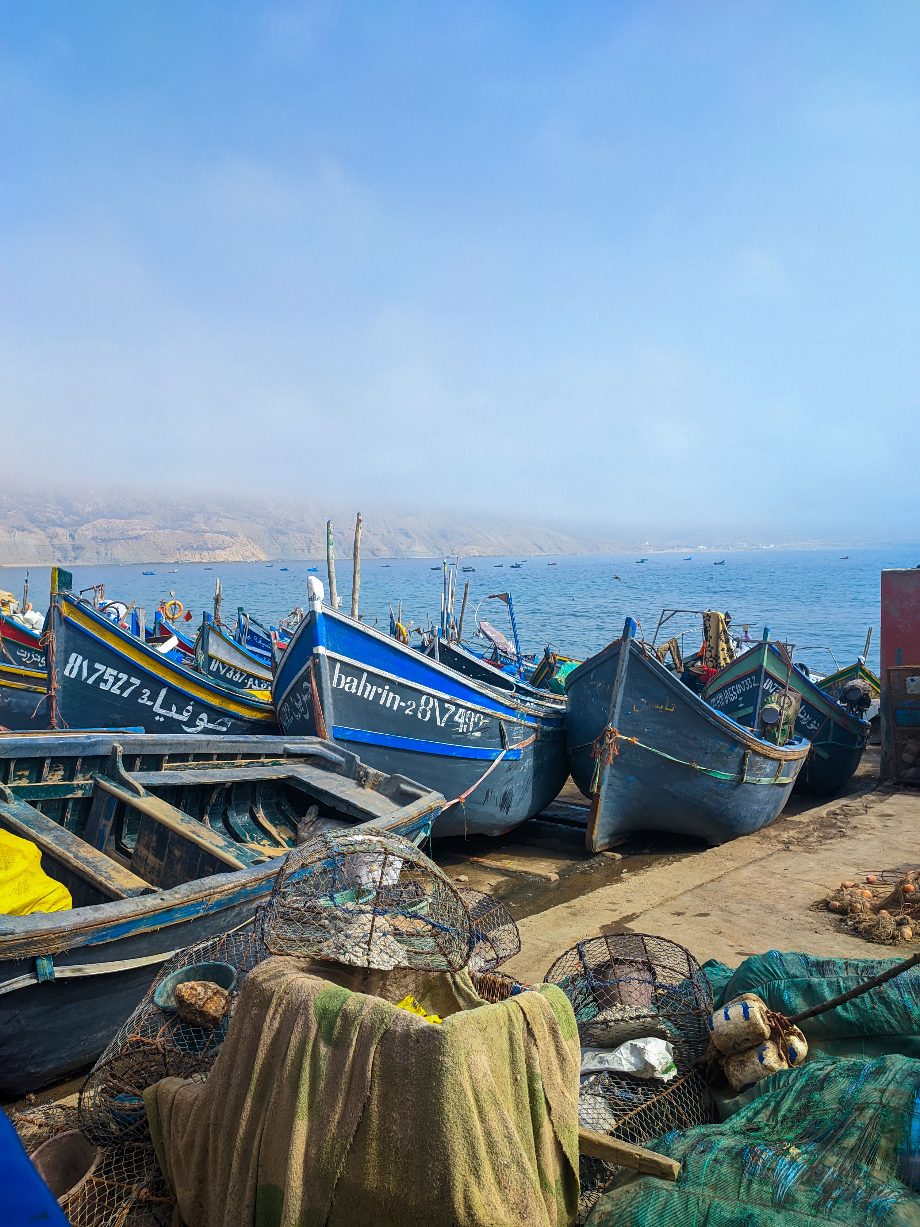 Traditional Fishing Boats on a Misty Harbor · Free Stock Photo
