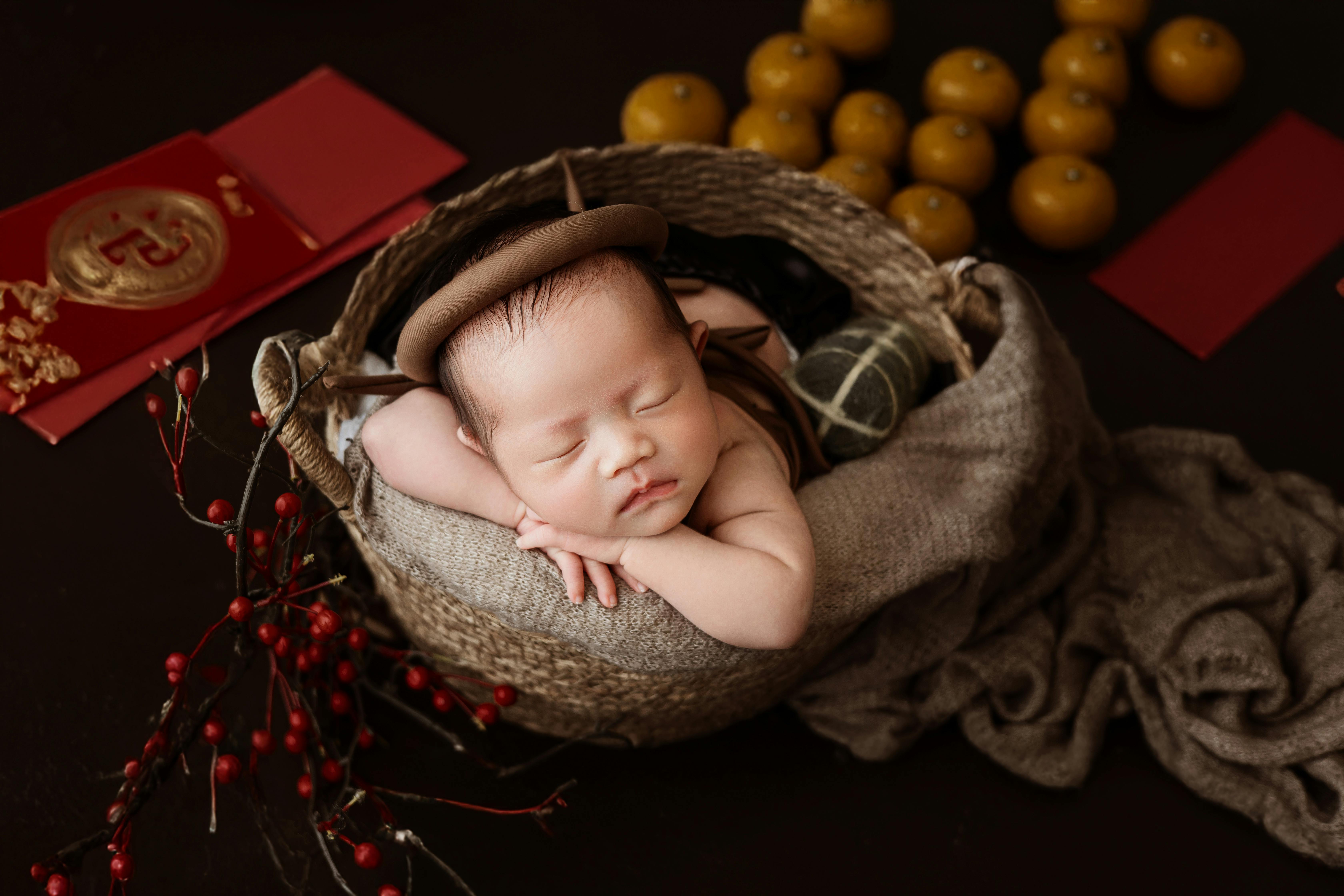 Adorable Newborn in Traditional Vietnamese Setting · Free Stock Photo
