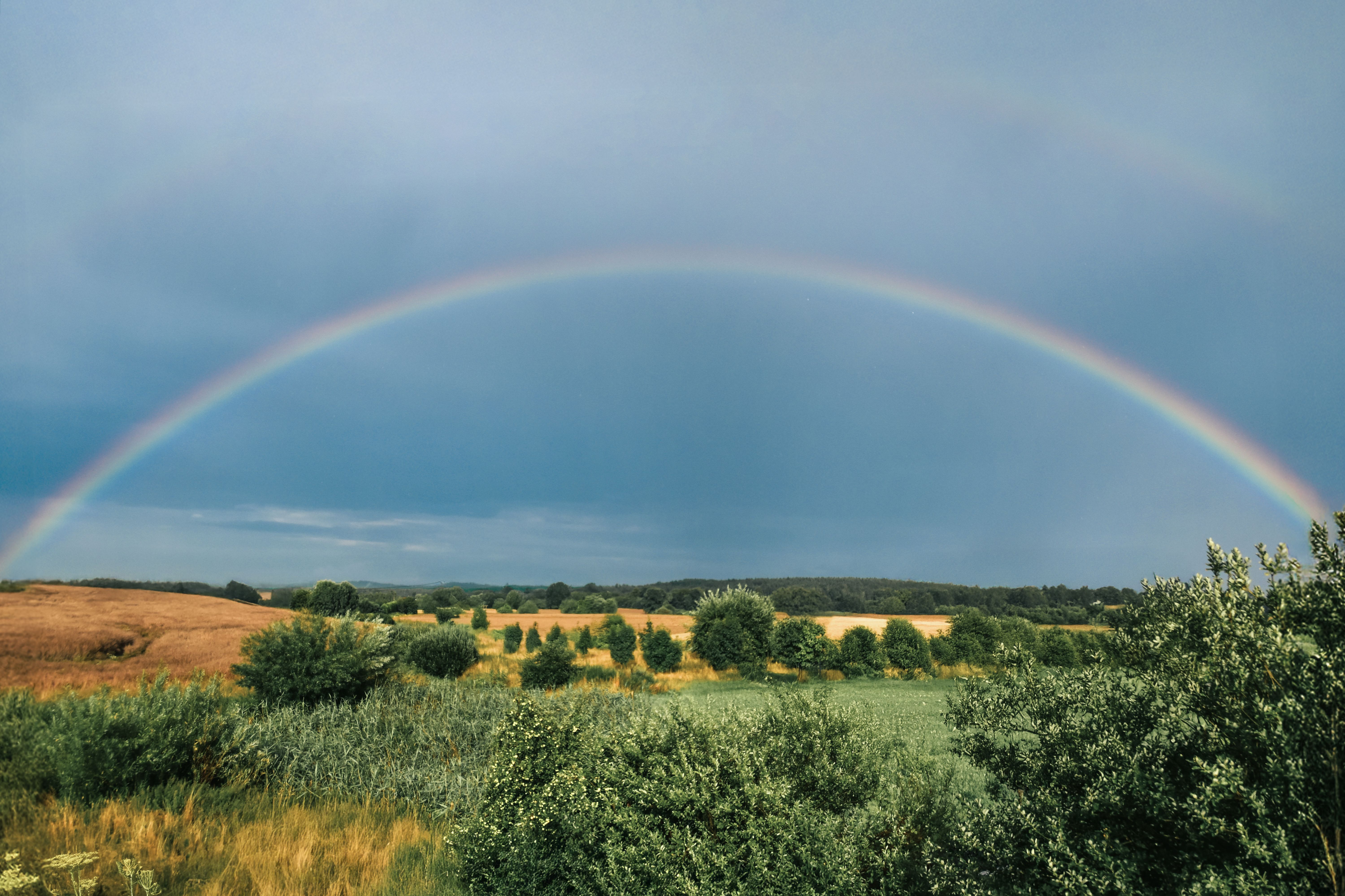 Vibrant Summer Rainbow Over Trąbki Wielkie Landscape · Free Stock Photo