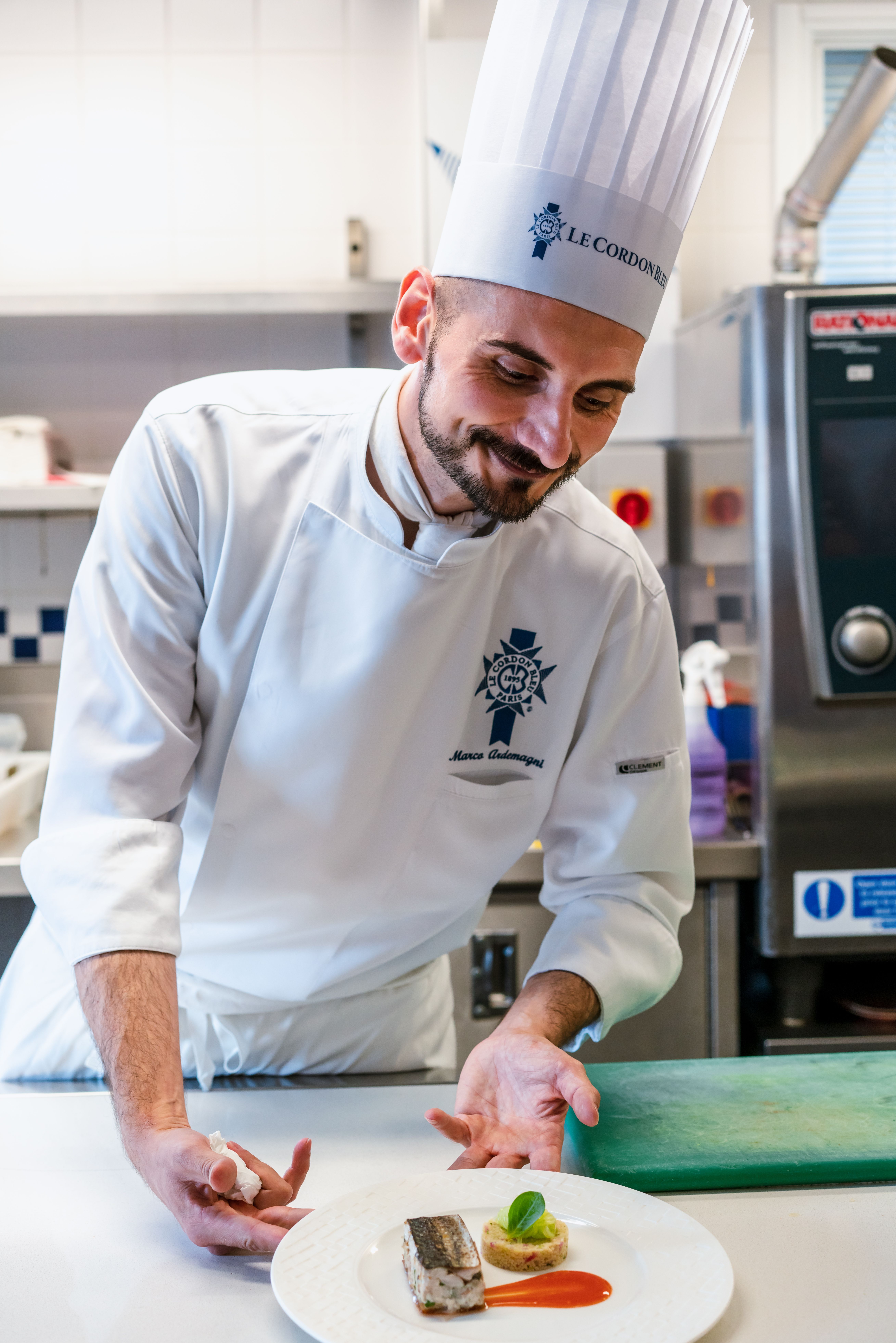 Professional Chef Presenting Exquisite Dish · Free Stock Photo