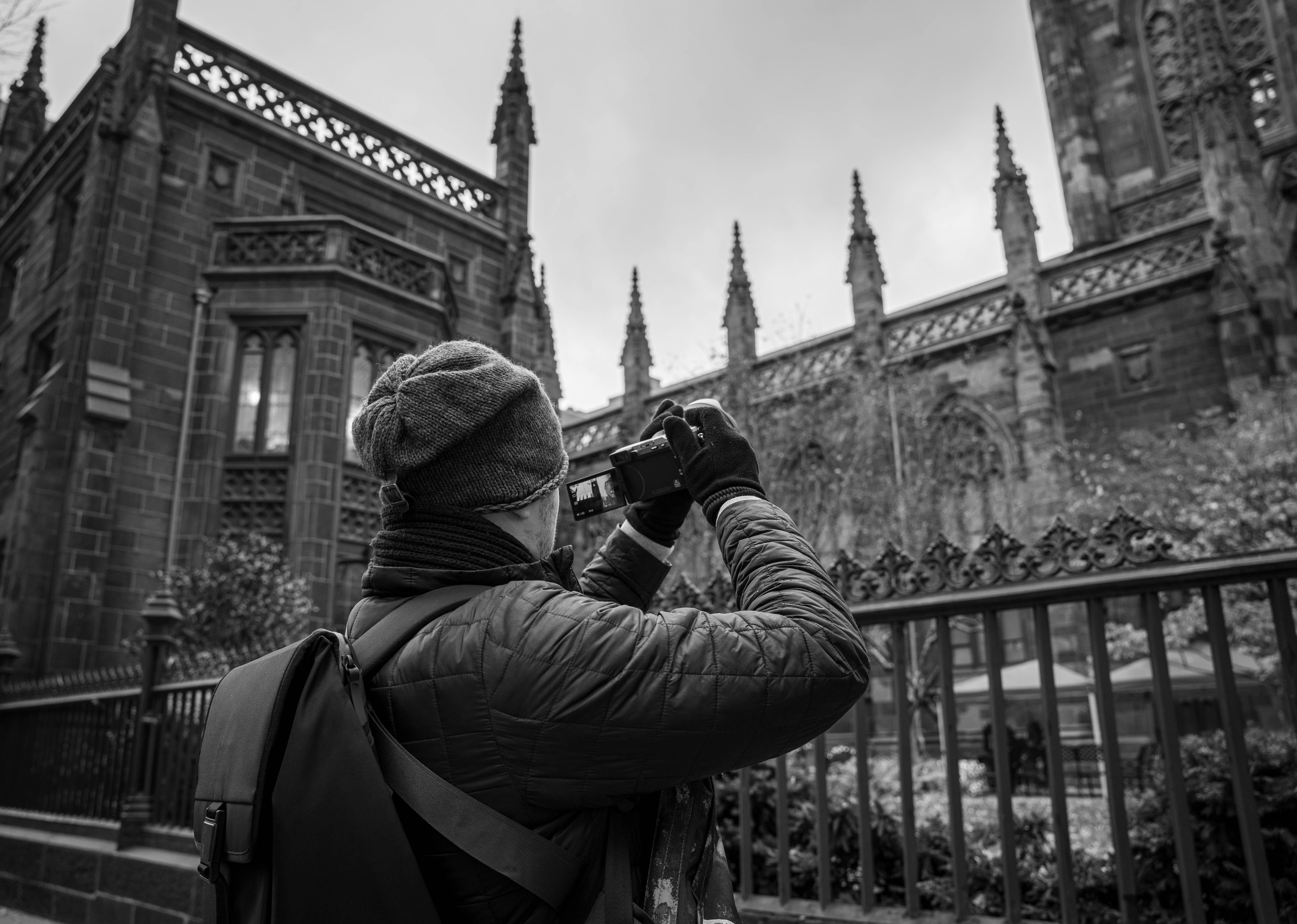 Street Photographer Capturing Gothic Architecture · Free Stock Photo