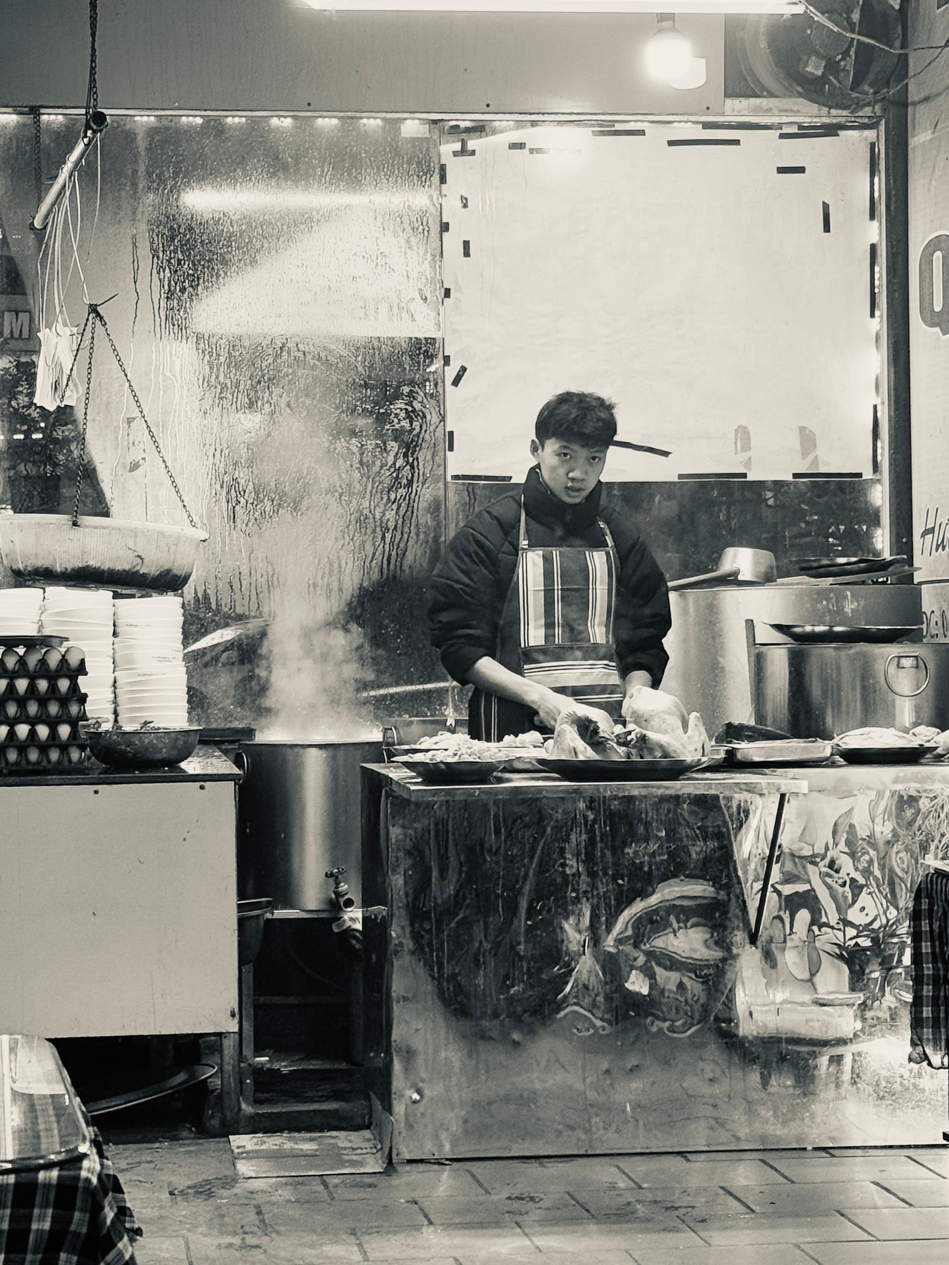 Street Food Vendor Cooking at Urban Market · Free Stock Photo