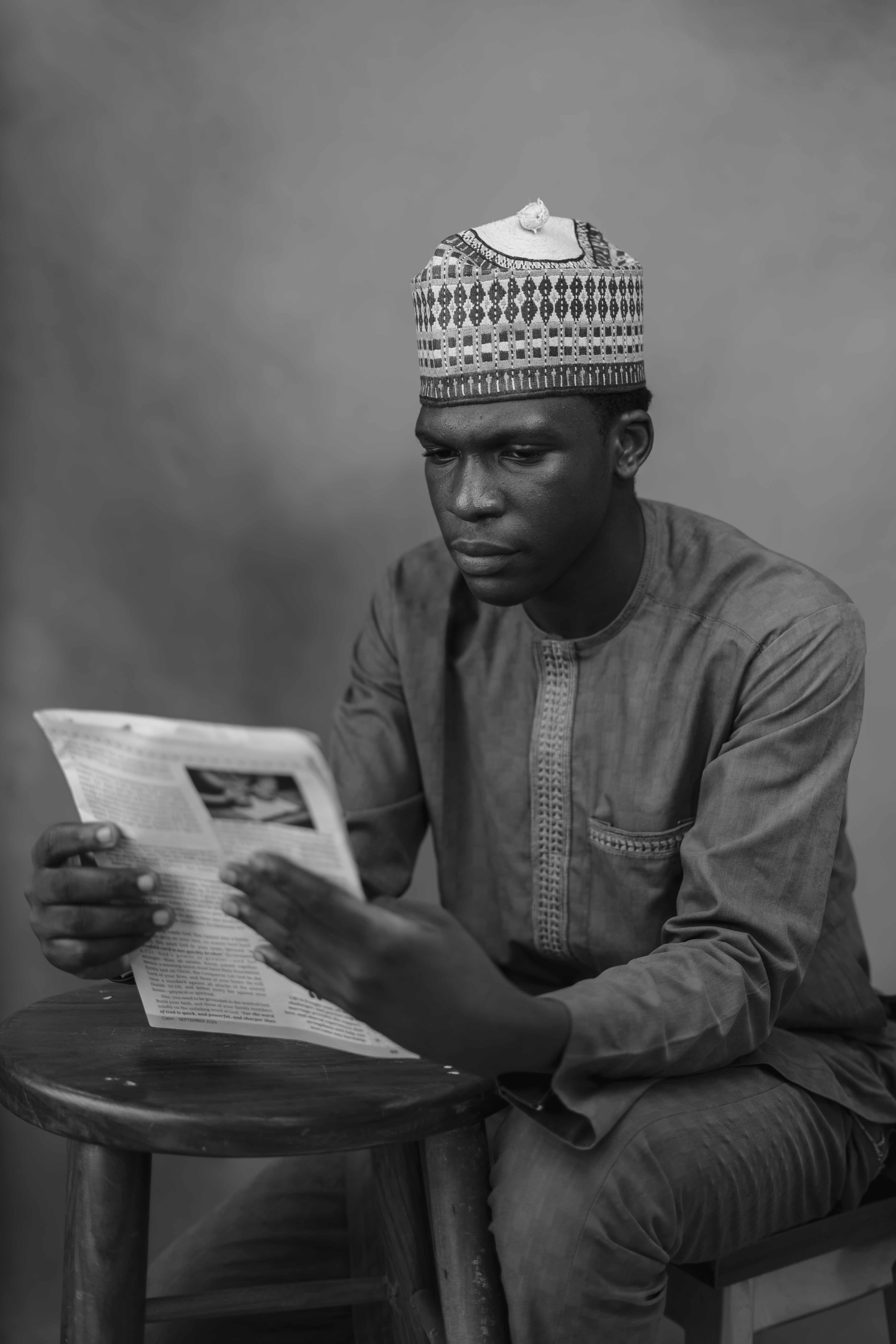 Black man reading Islamic sacred book · Free Stock Photo