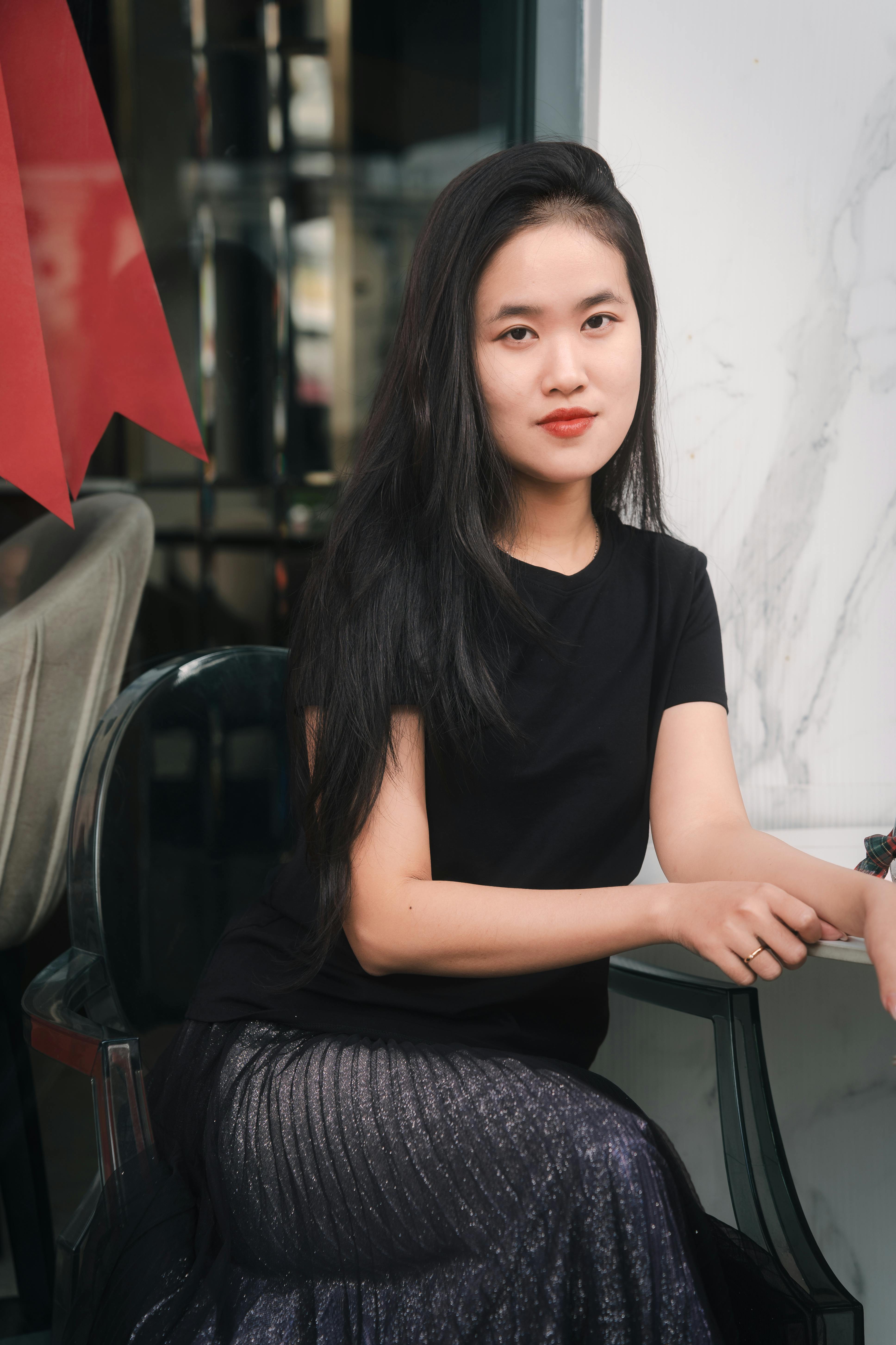 Portrait of a Young Woman in a Modern Setting · Free Stock Photo