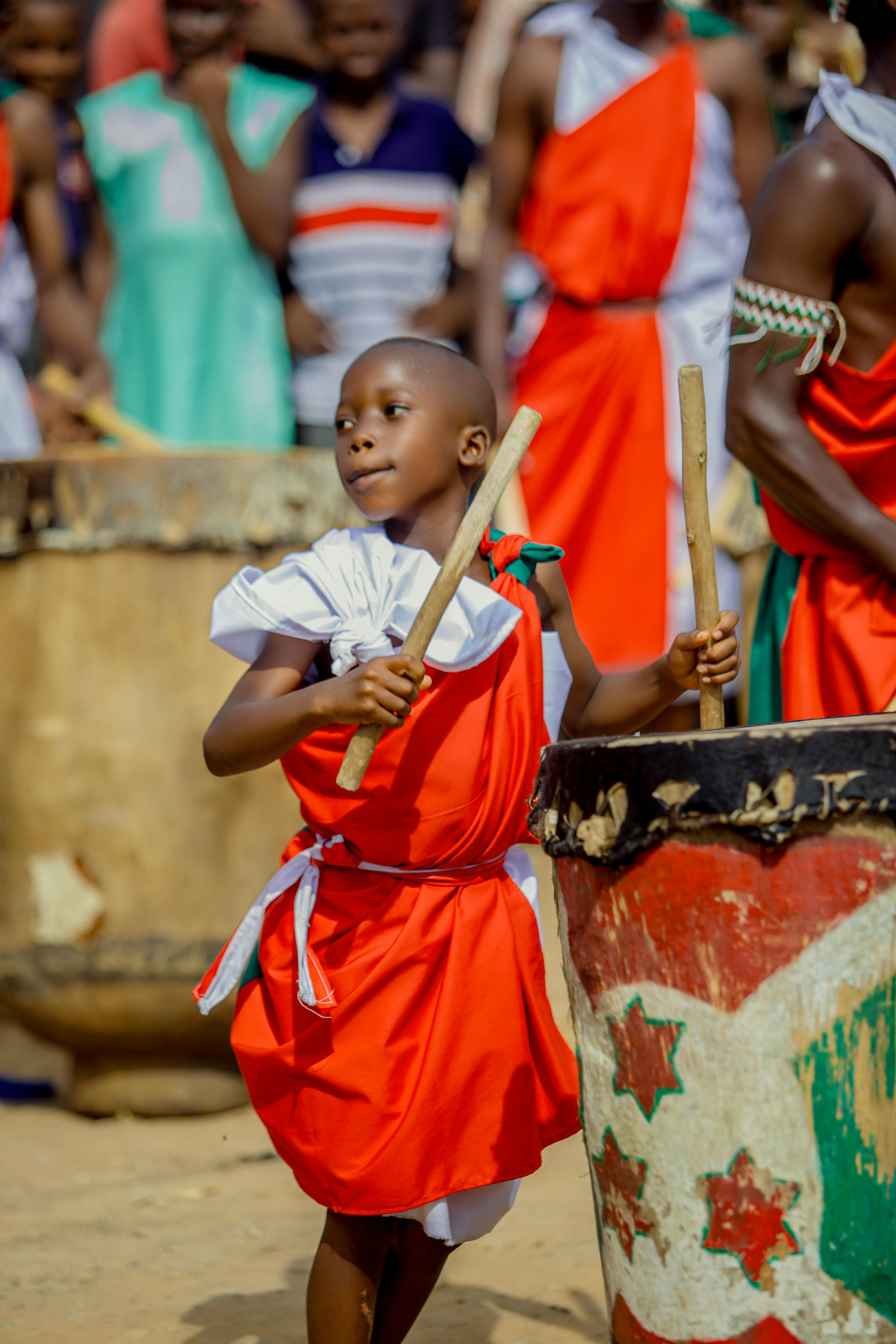 Traditional Drum Performance with Child in Vibrant Attire · Free Stock ...