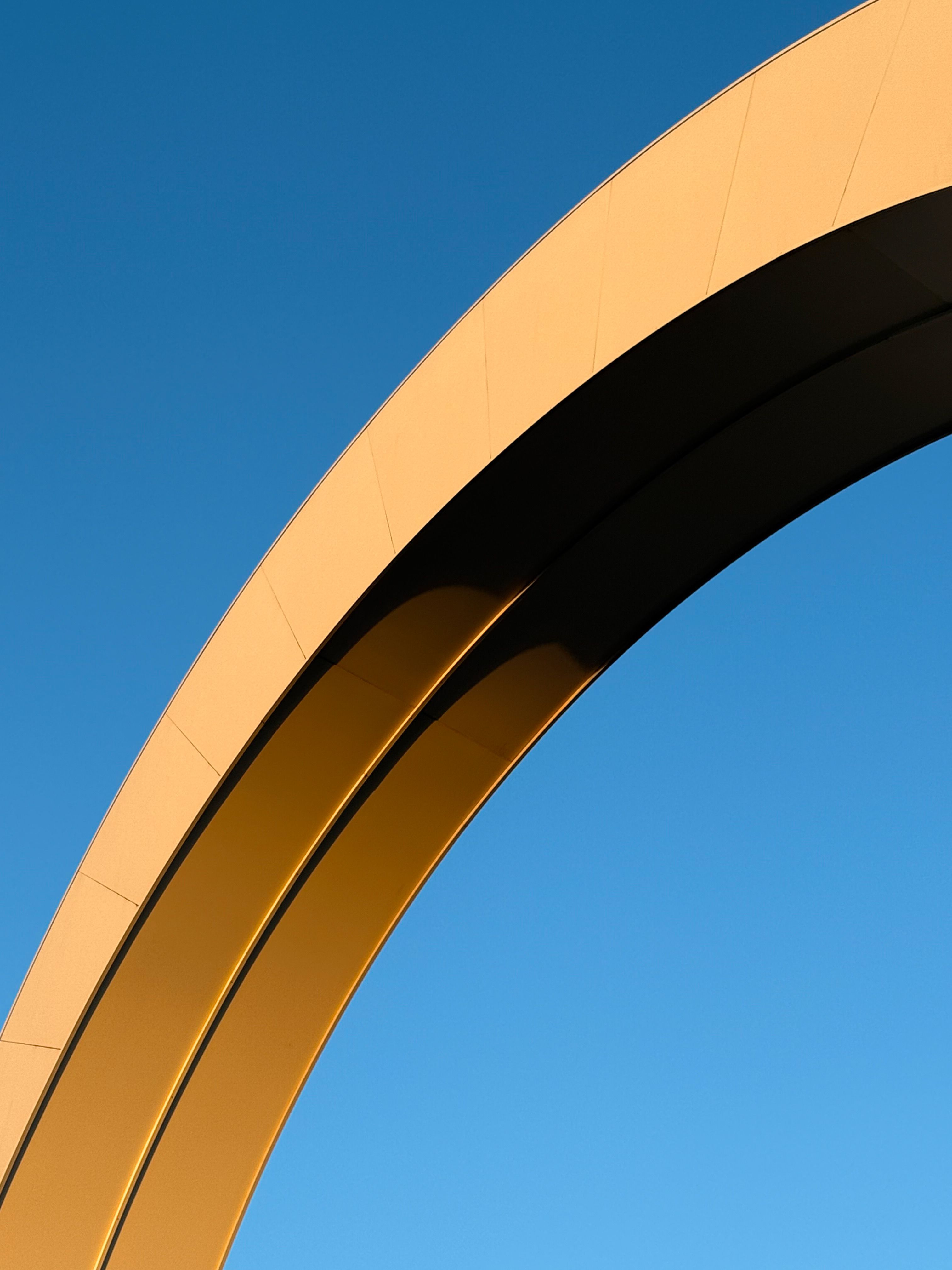 Modern Abstract Arch Against Blue Sky · Free Stock Photo