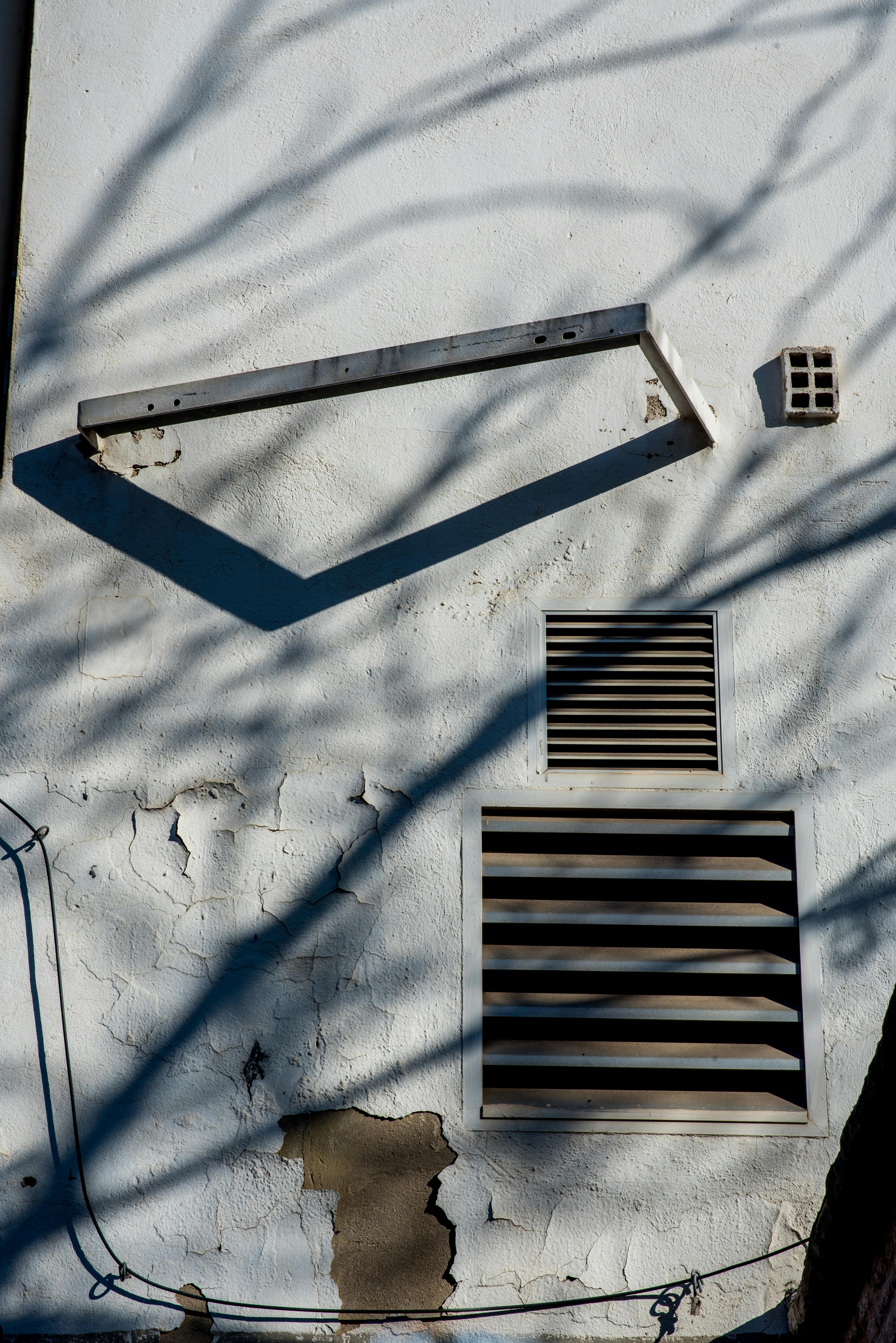 Abstract Shadow and Wall Vent Composition · Free Stock Photo