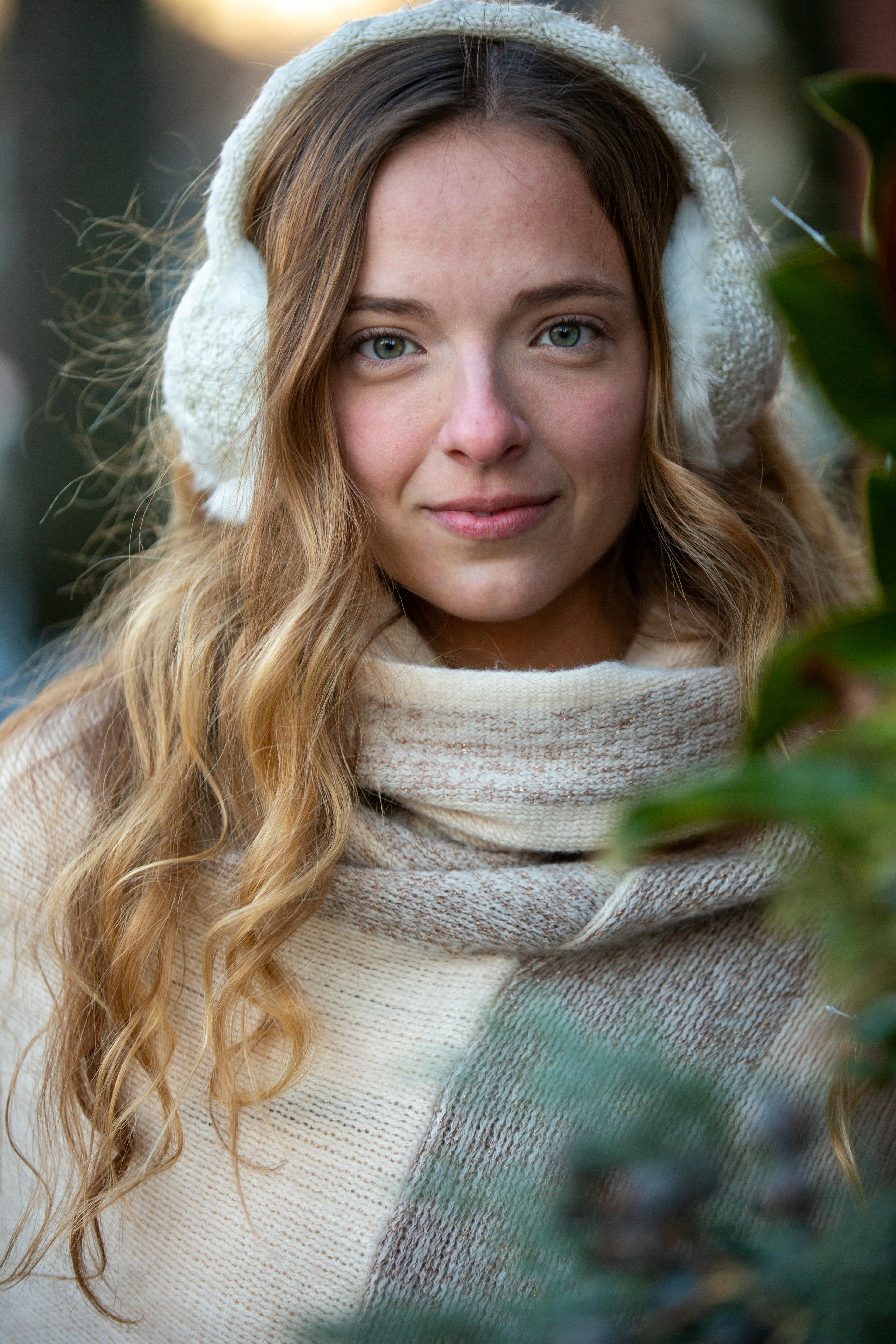 Young Woman in Winter Attire with Ear Muffs · Free Stock Photo