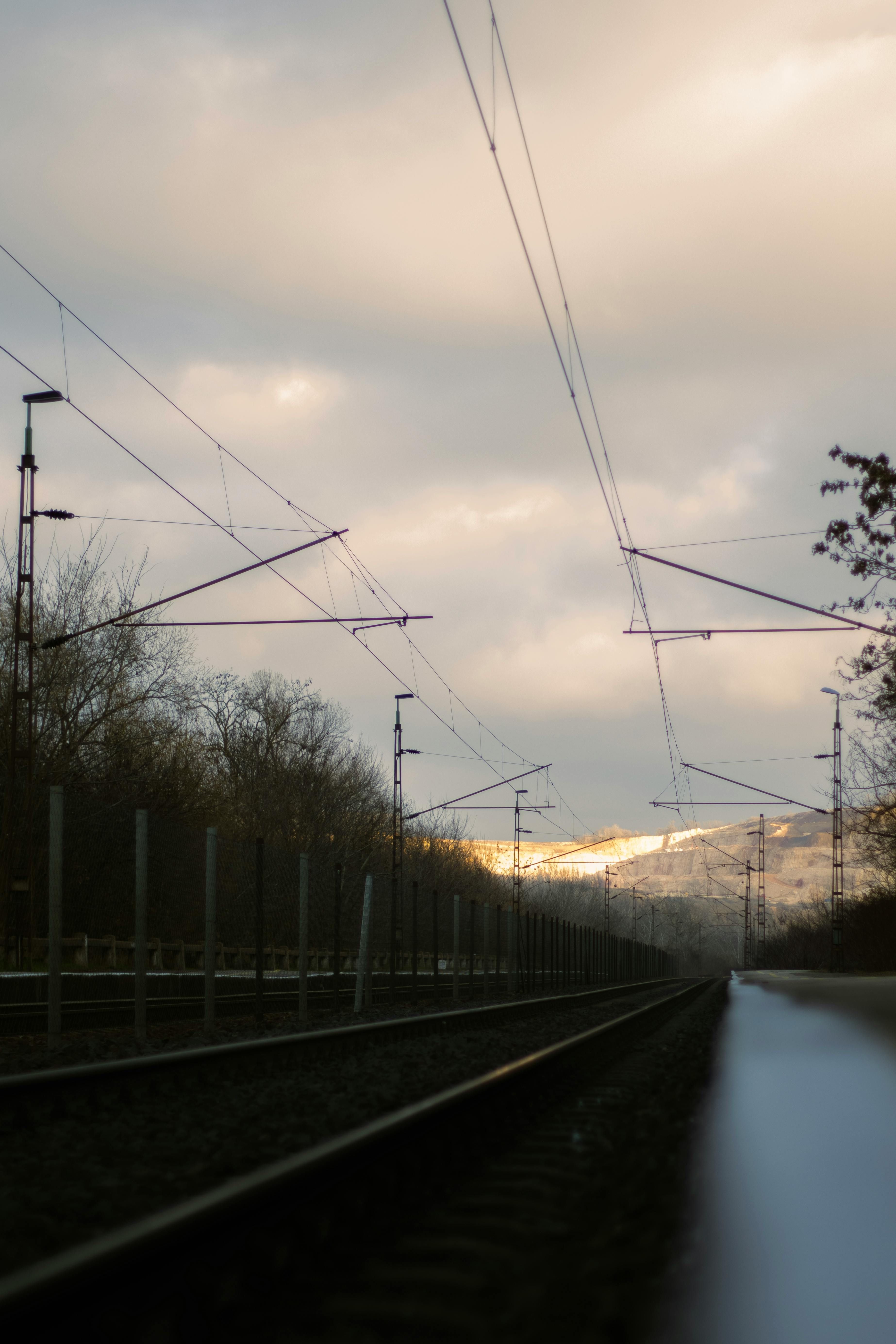 Serene Railroad Track at Sunset in Winter · Free Stock Photo