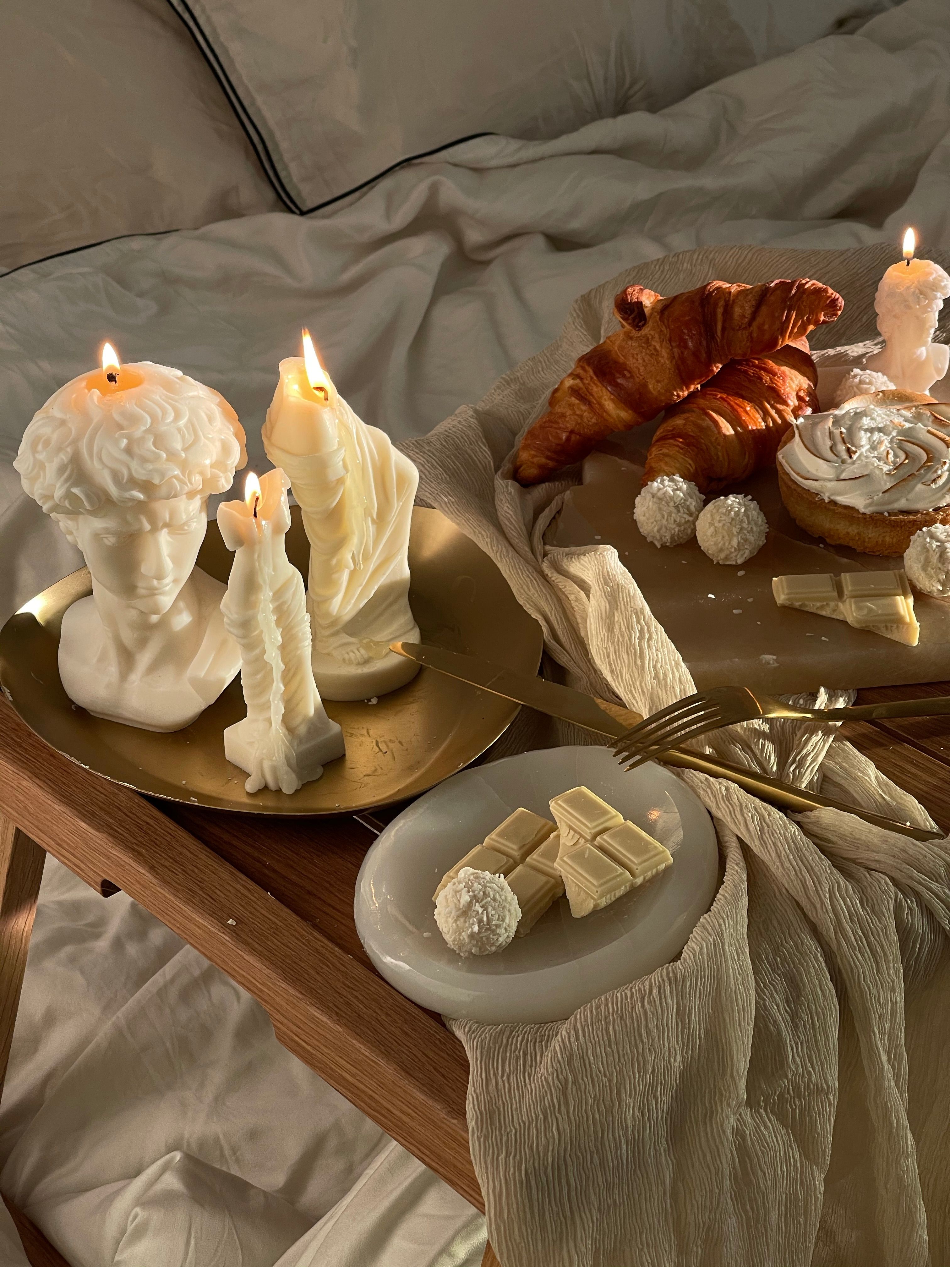 Elegant Breakfast Setting with Candles and Pastries · Free Stock Photo