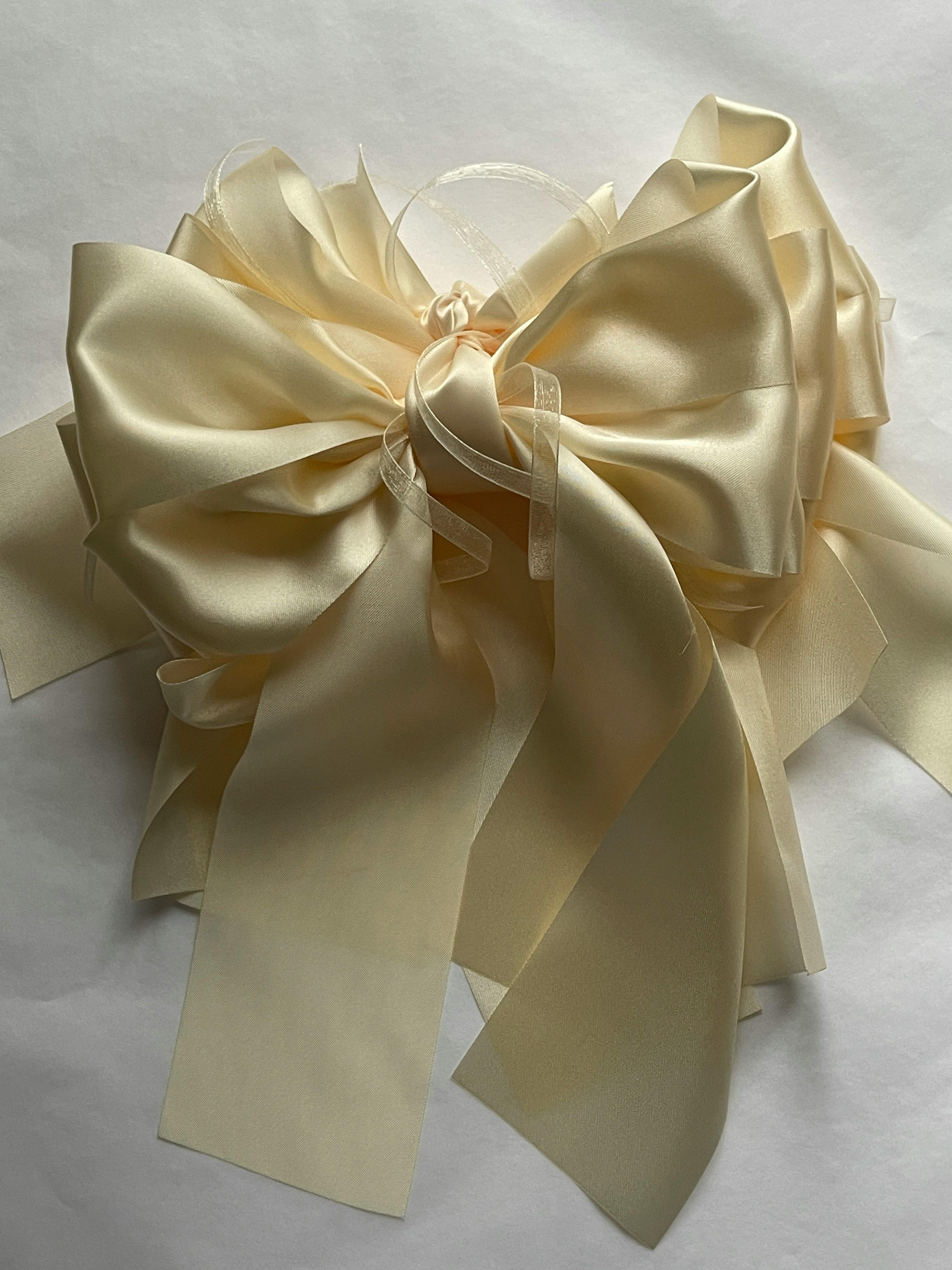 Elegant Cream Satin Ribbon Bow on White Background · Free Stock Photo