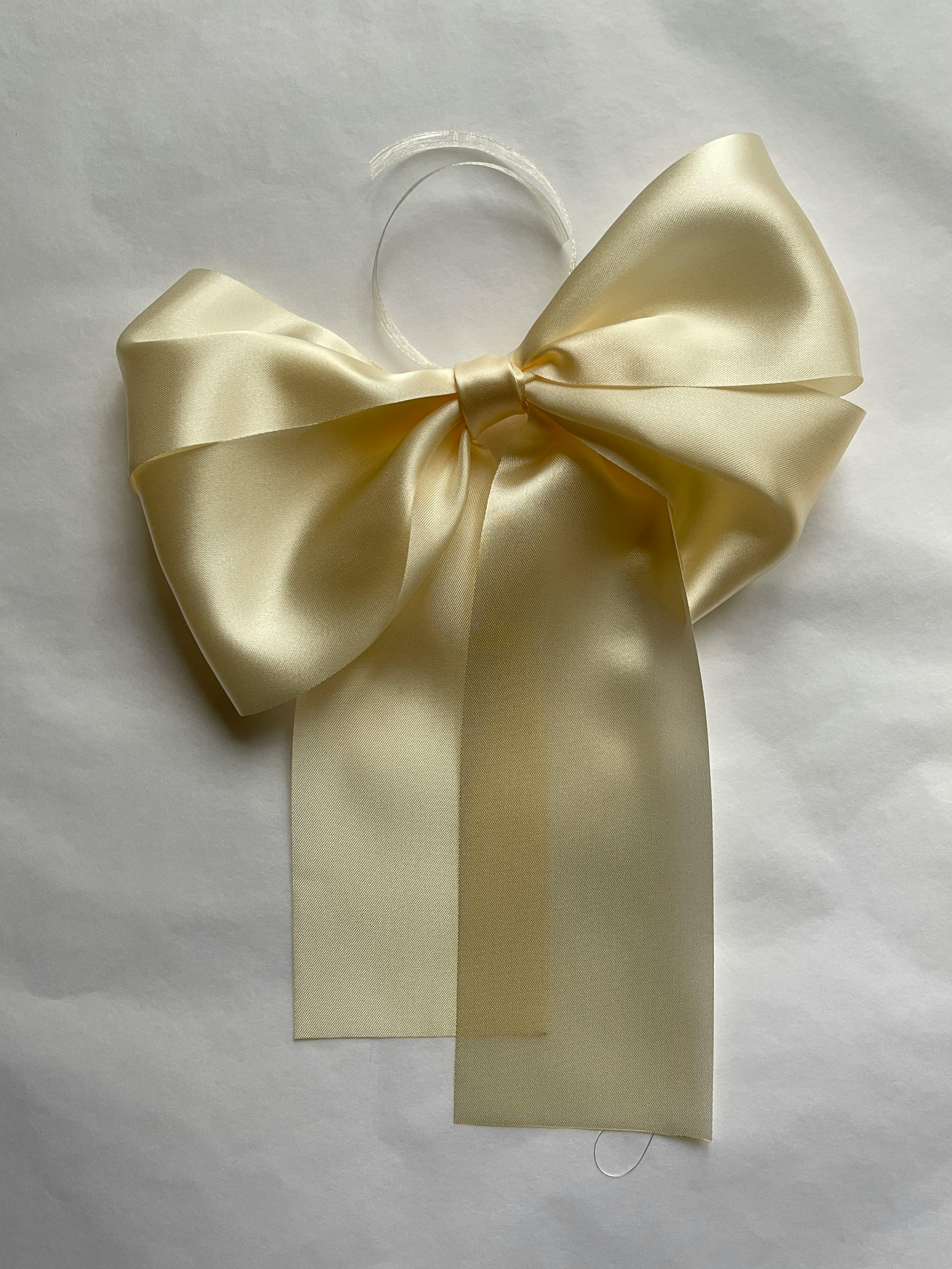 Elegant Cream Satin Bow on White Background · Free Stock Photo