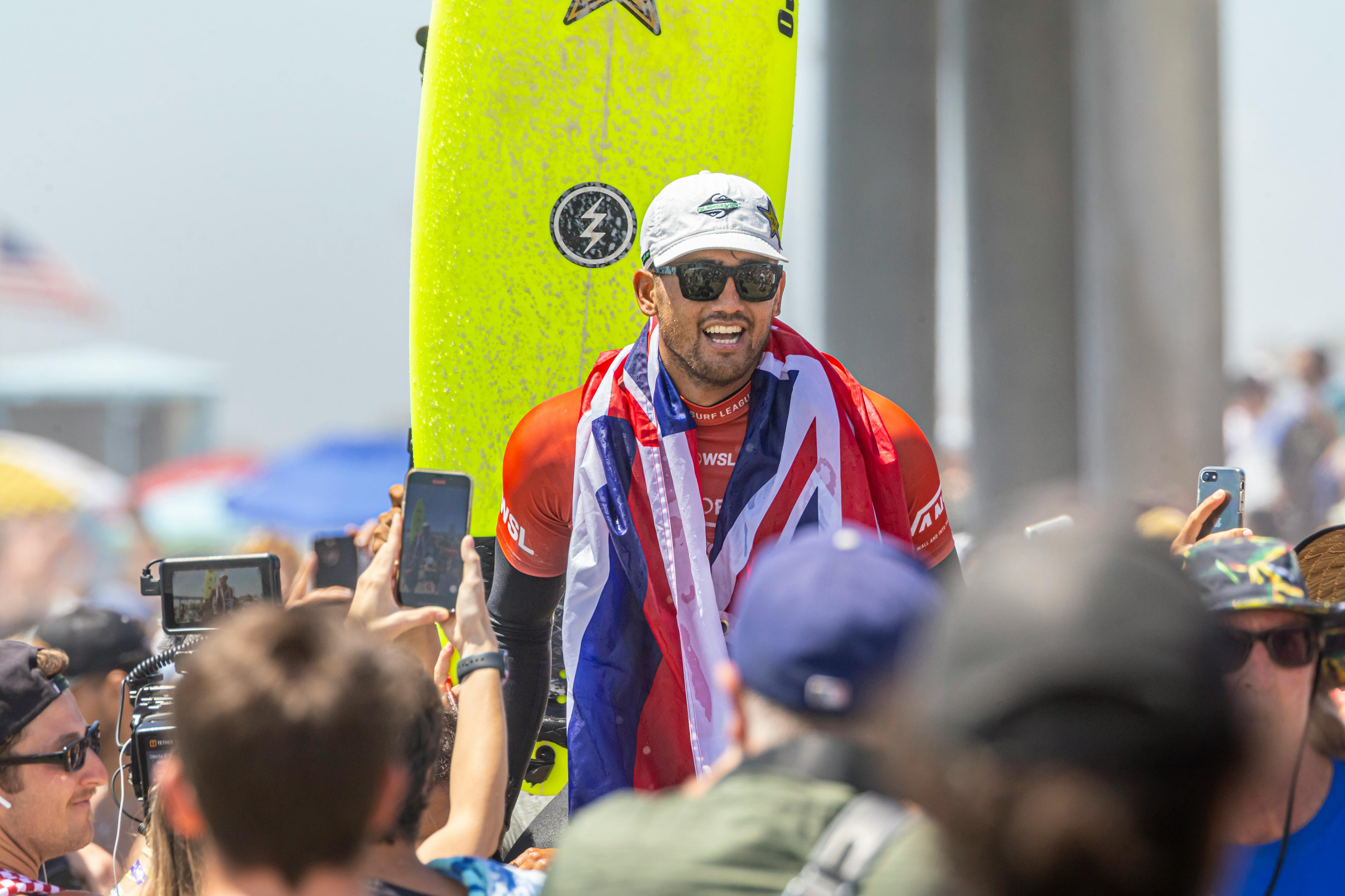 Surfing Champion Celebrating with Fans in Crowd · Free Stock Photo
