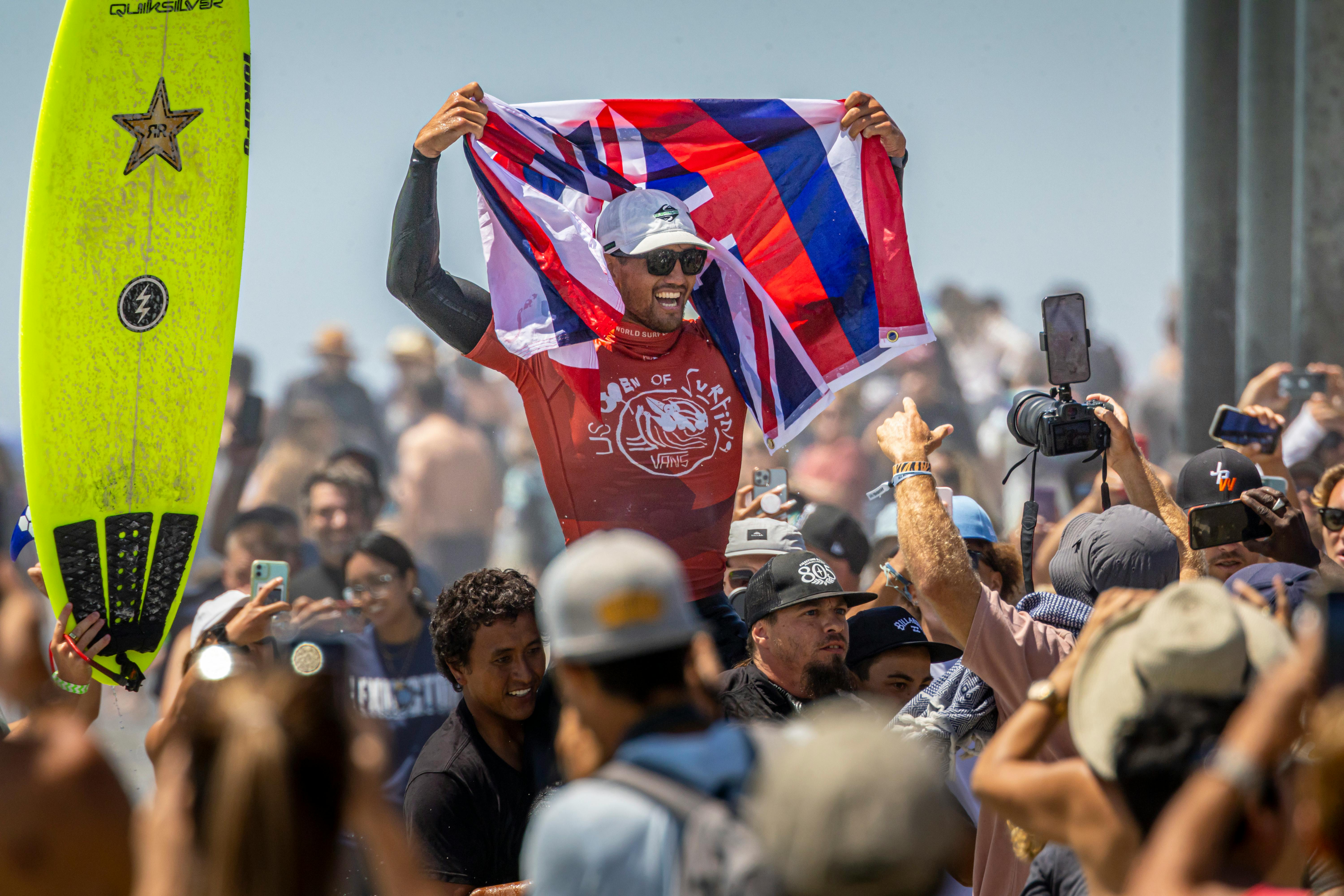 Champion Surfer Celebrates Victory with Fans · Free Stock Photo
