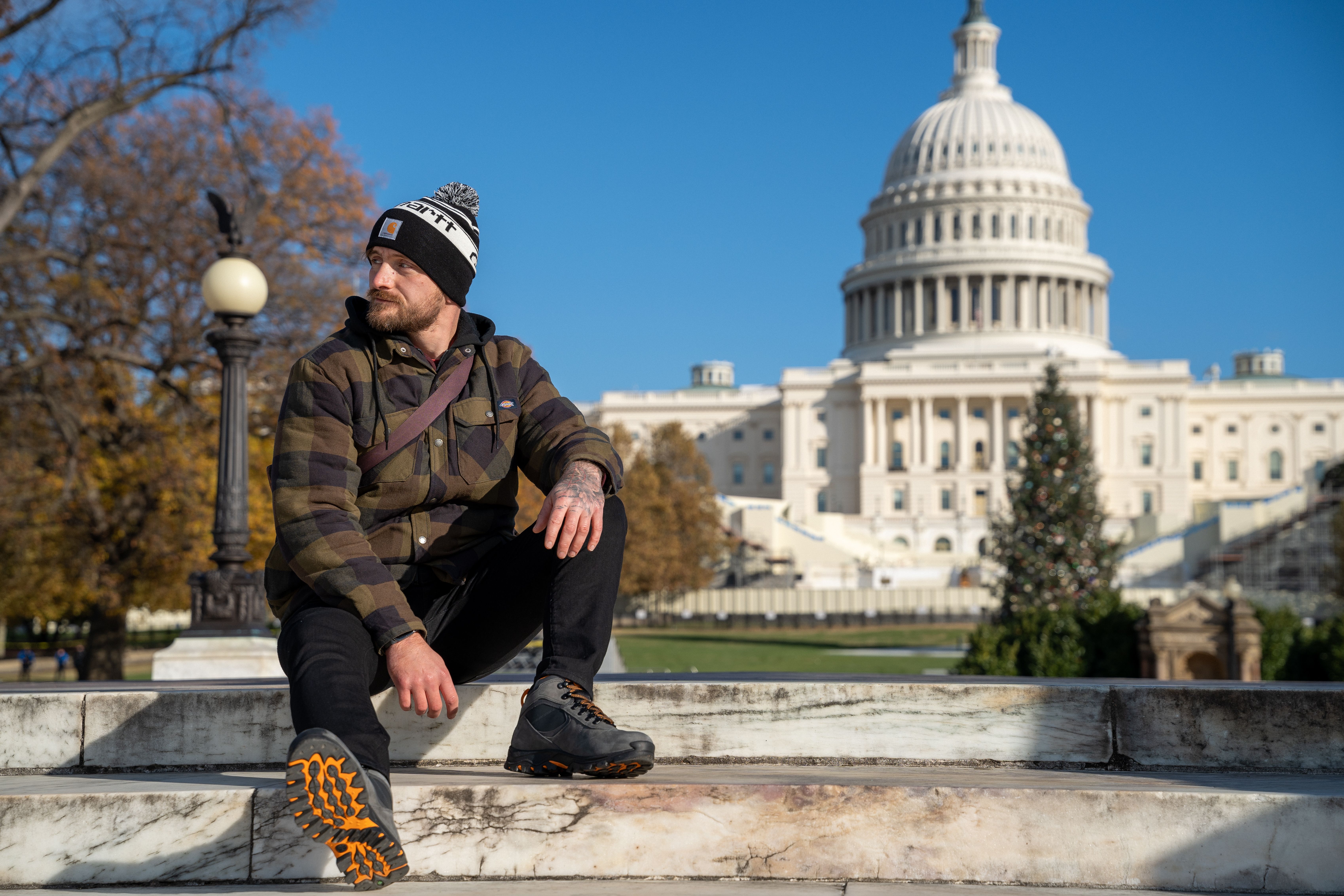 Man Posing in Front of the US Capitol Building · Free Stock Photo