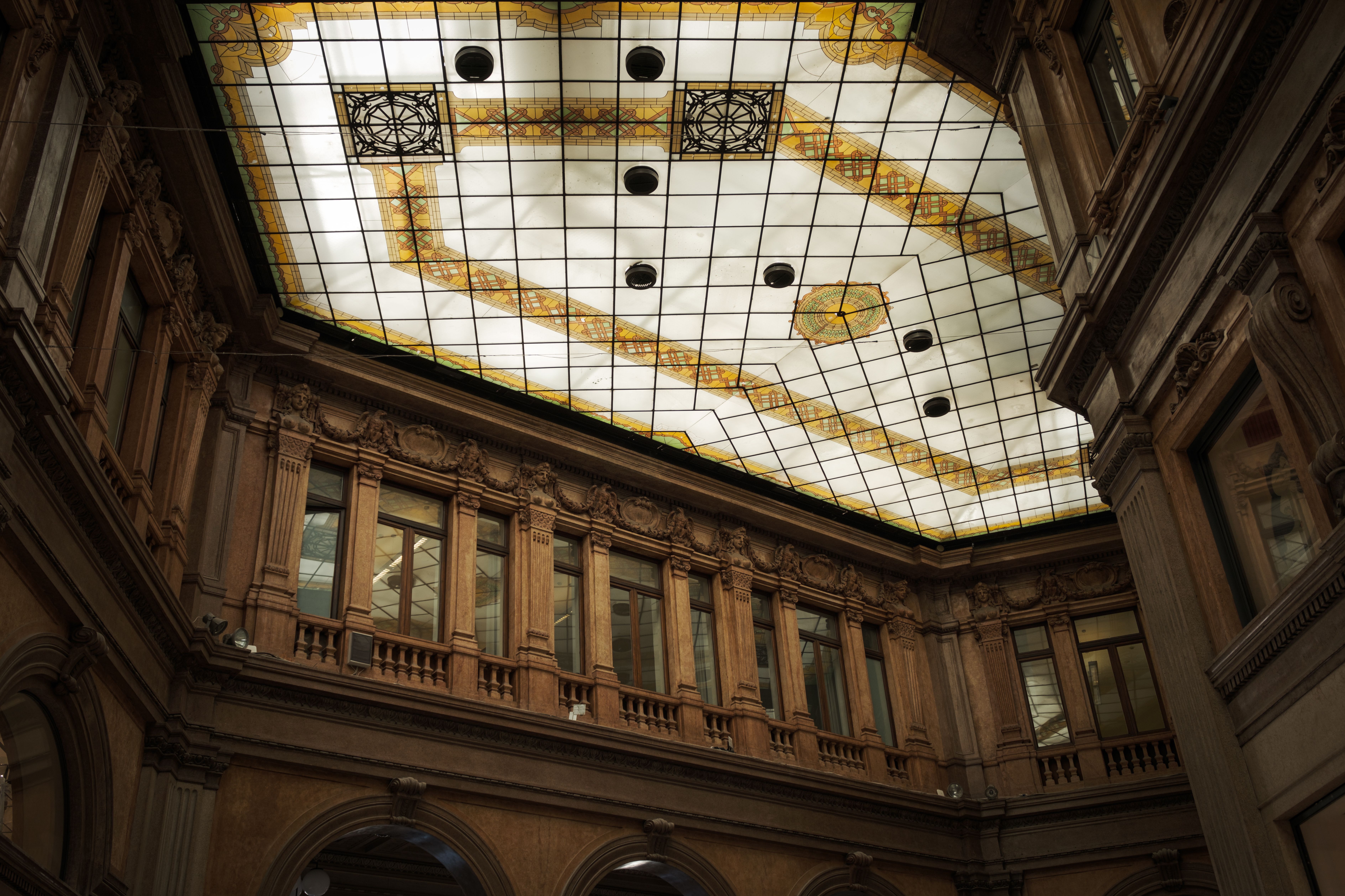 Elegant Interior Atrium with Stained Glass Roof · Free Stock Photo