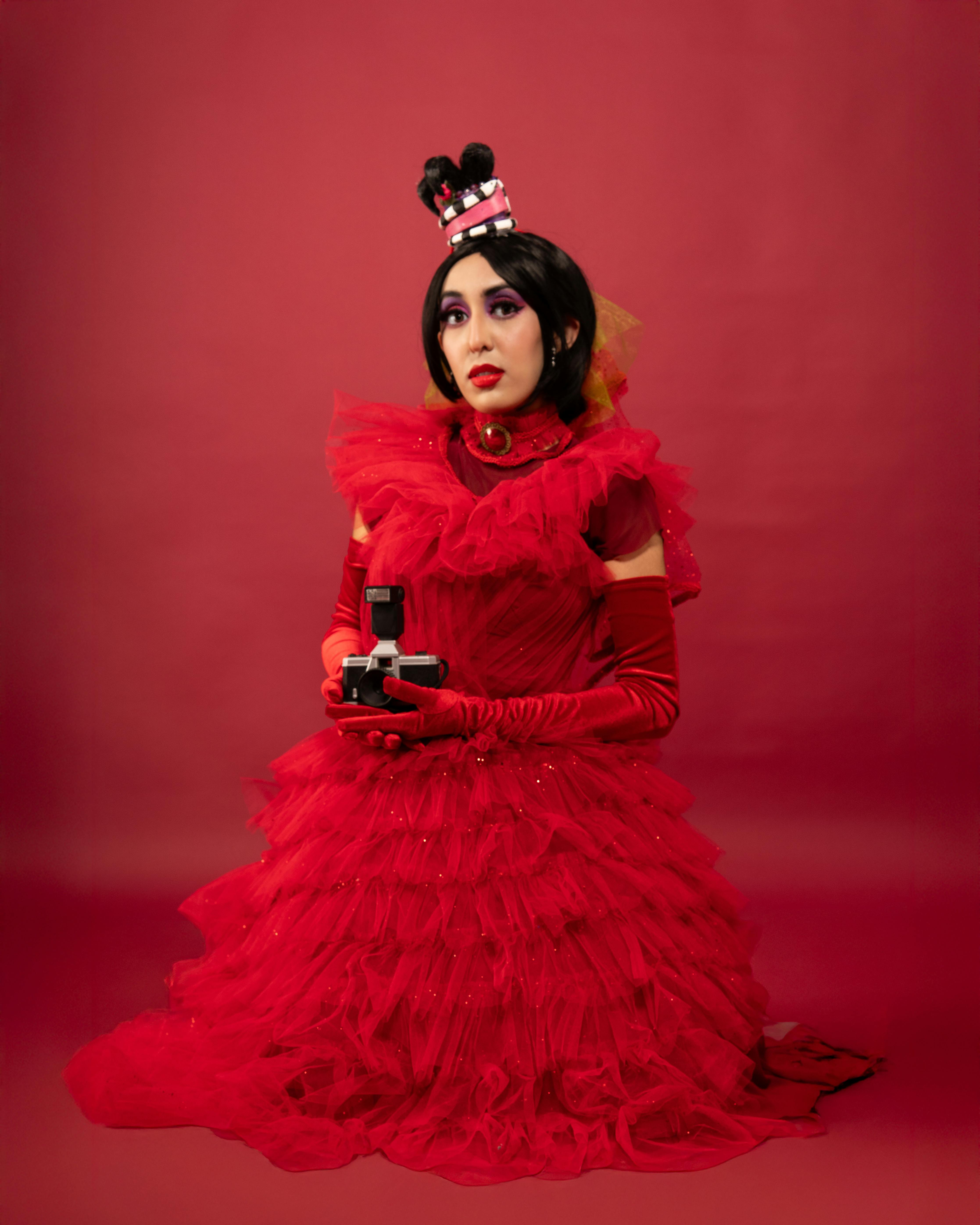 Stylish Red Cosplay Portrait with Camera · Free Stock Photo