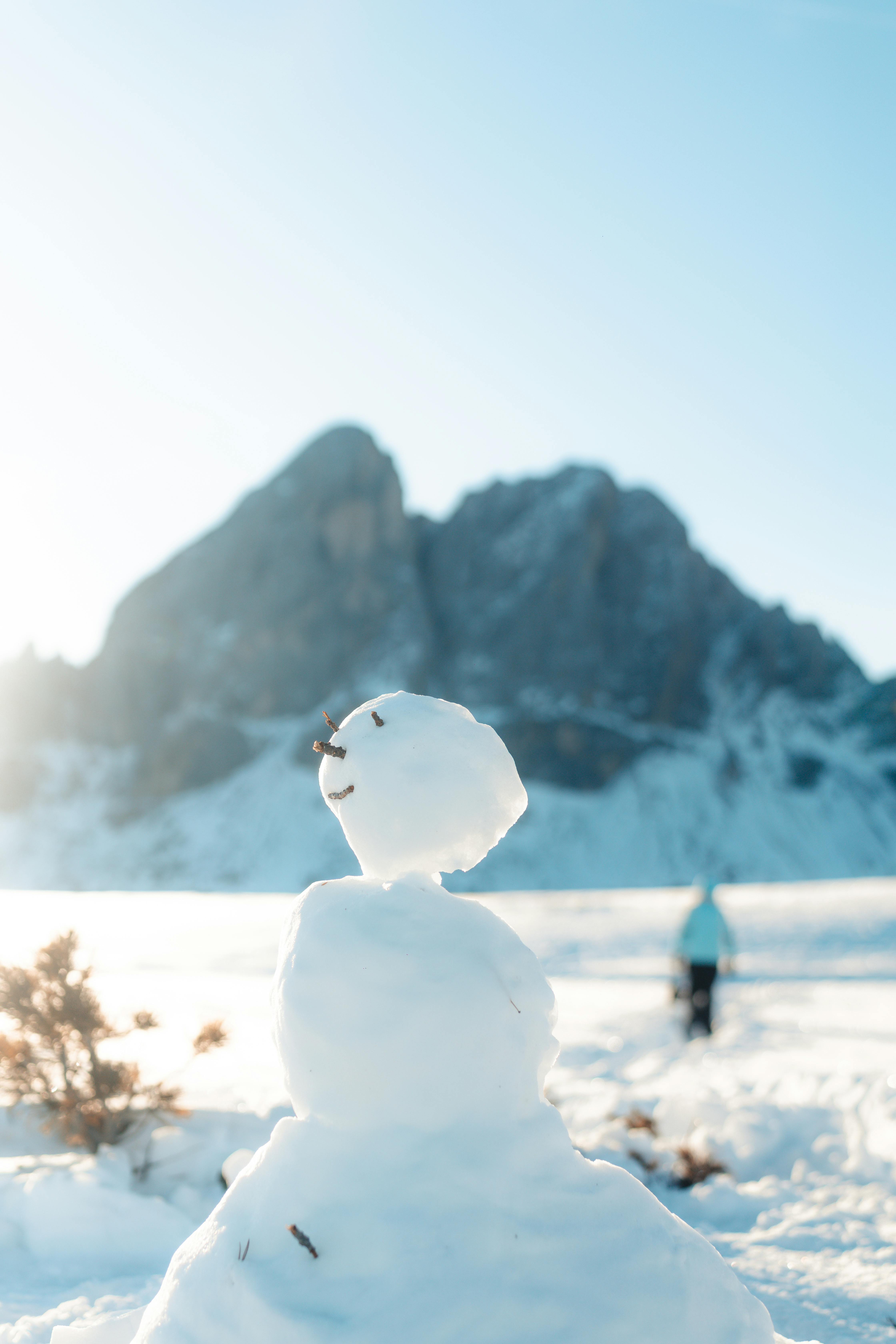 Snowman in Scenic Winter Mountain Landscape · Free Stock Photo