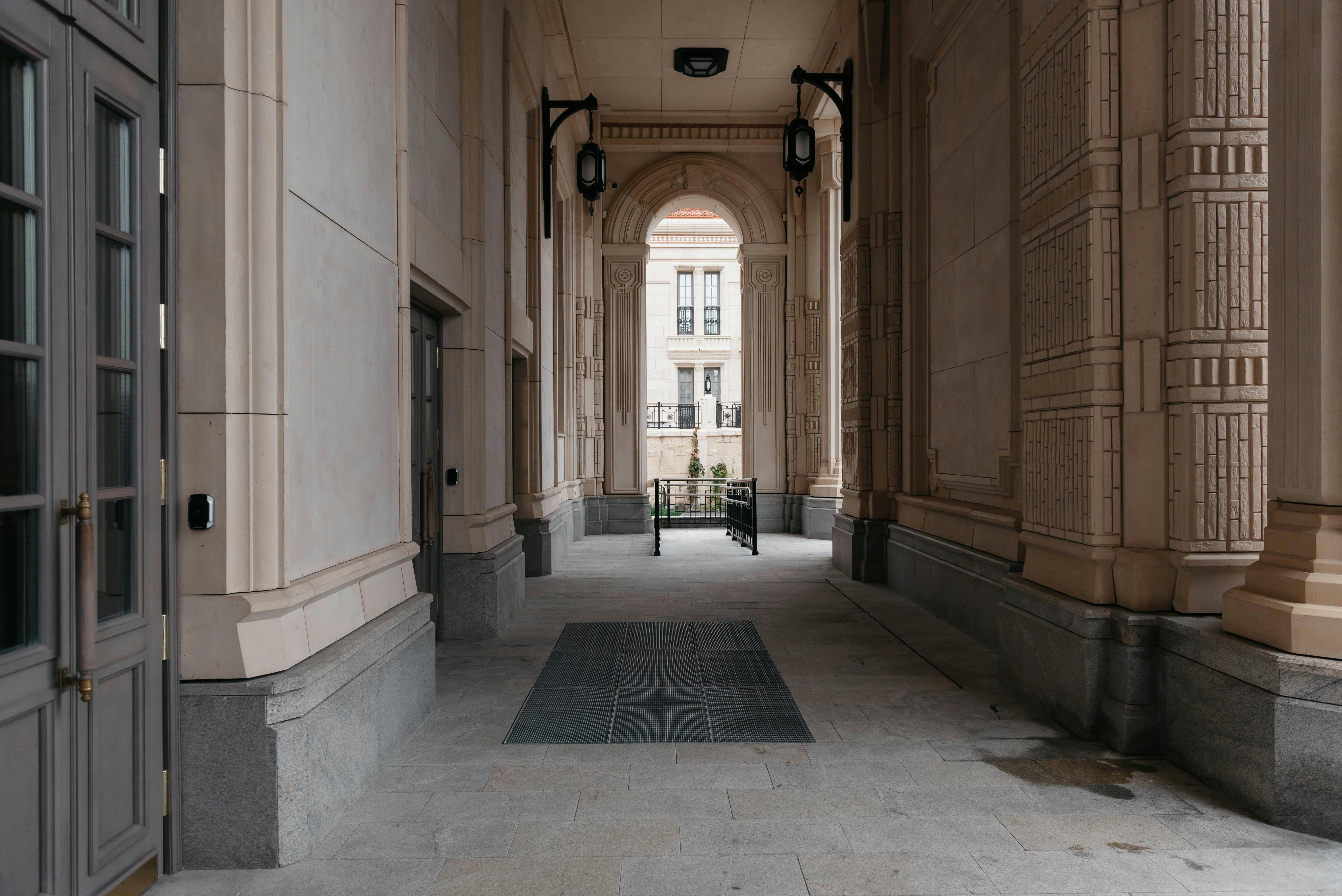 Elegant Architectural Corridor with Classic Design · Free Stock Photo