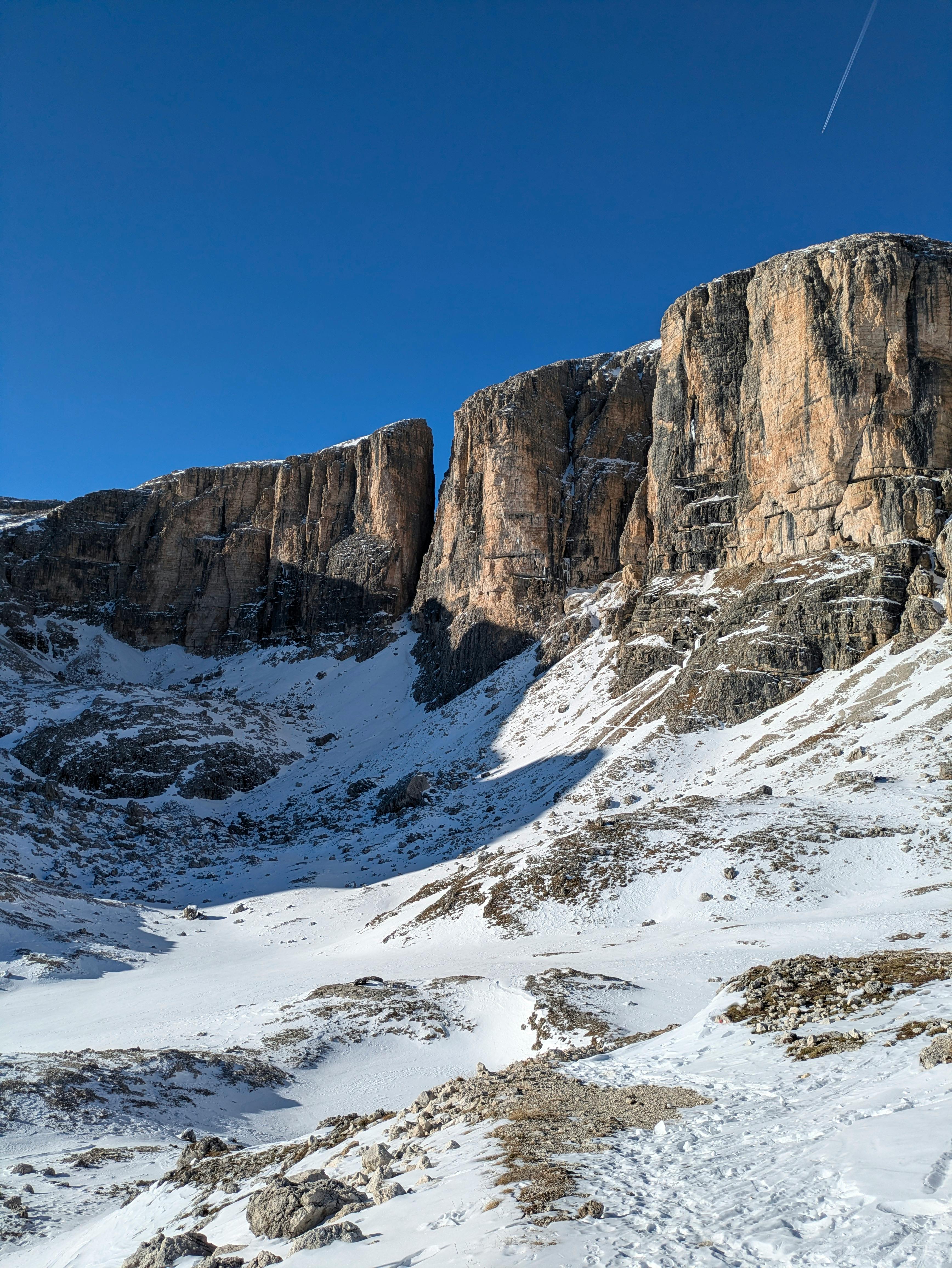 Majestic Snow-Covered Mountain Cliffs Under Clear Blue Sky · Free Stock ...