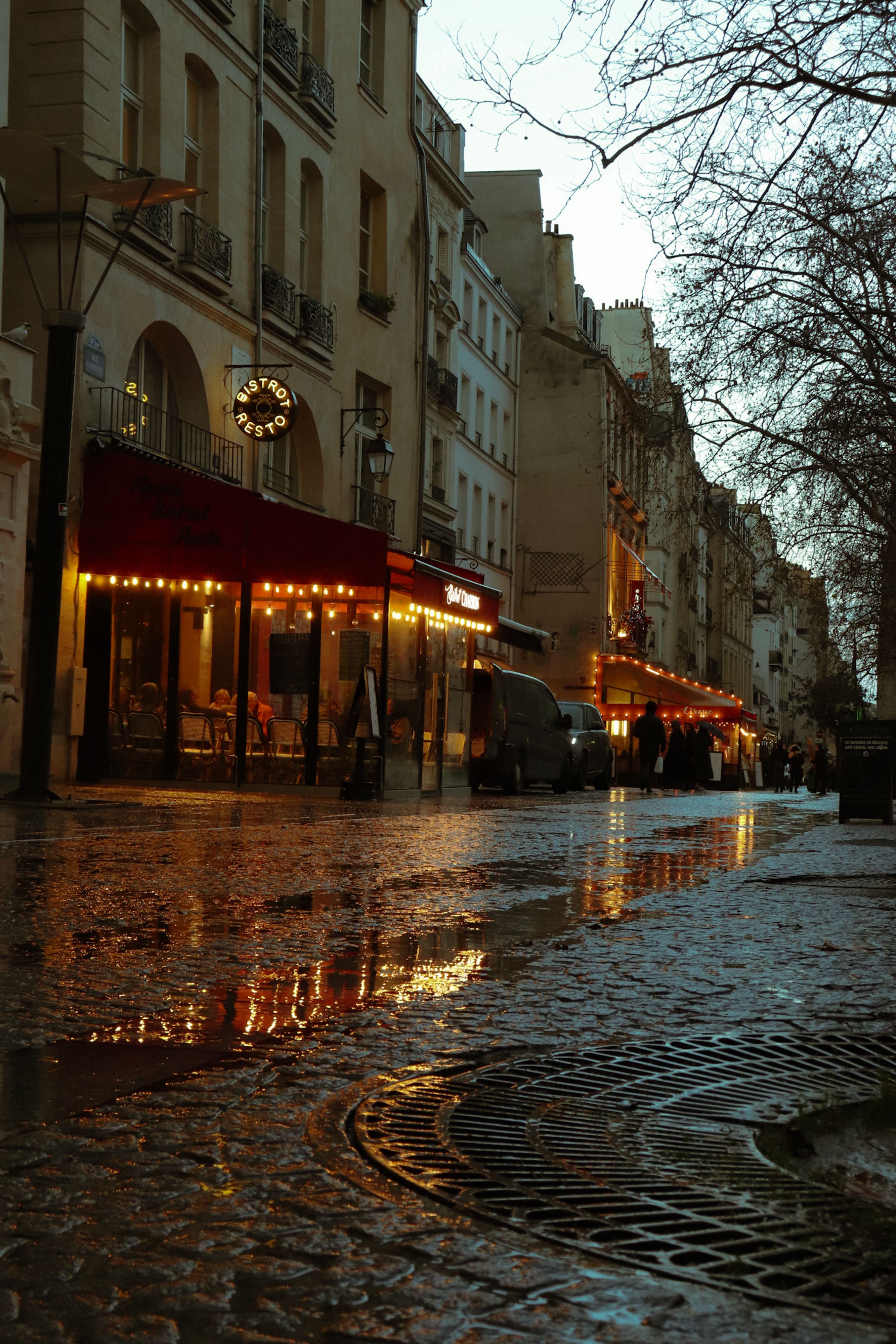 Parisian Street at Dusk with Reflections · Free Stock Photo