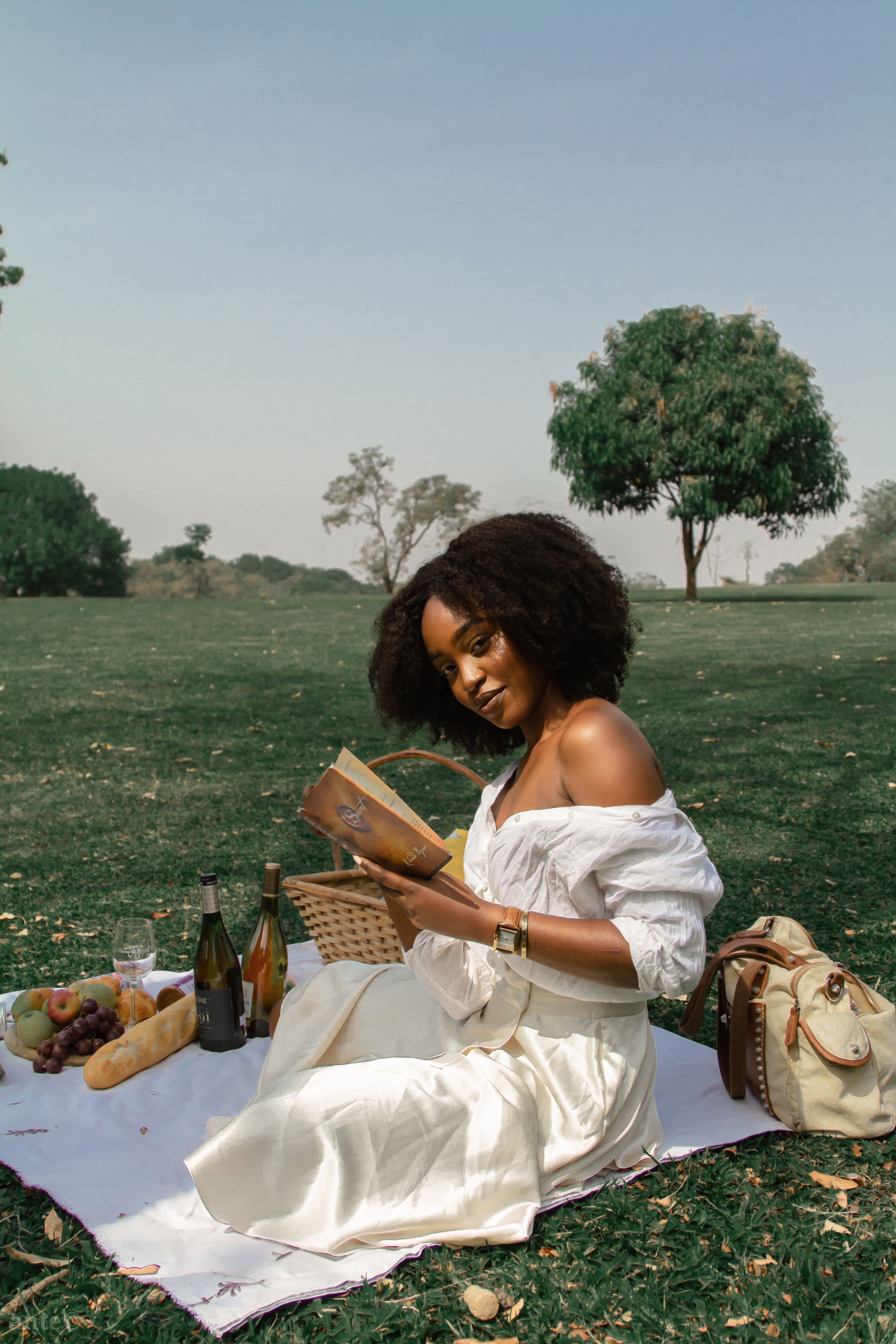 Woman Enjoying a Peaceful Picnic Outdoors · Free Stock Photo
