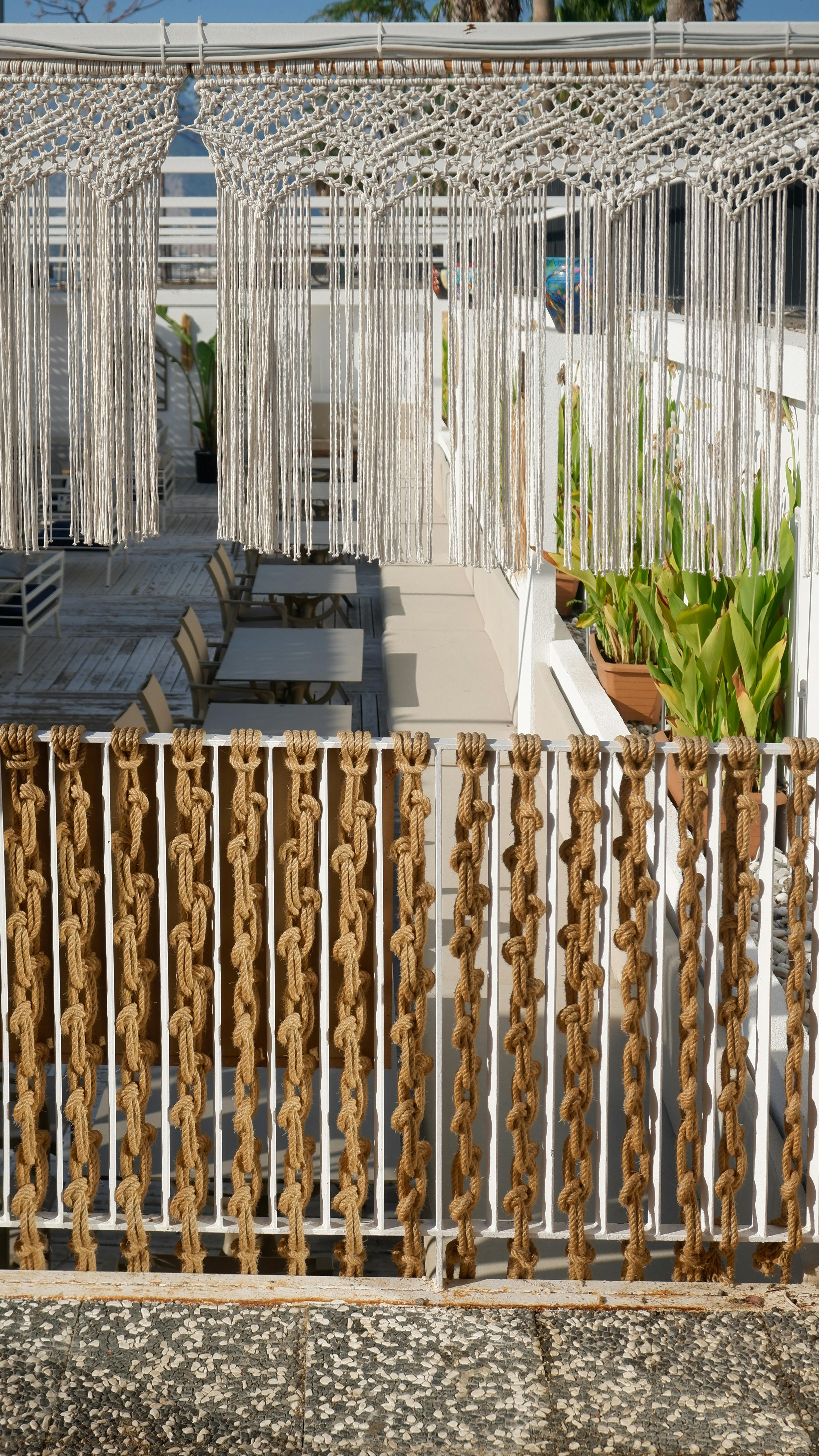 Sunny terrace with bohemian decor elements · Free Stock Photo