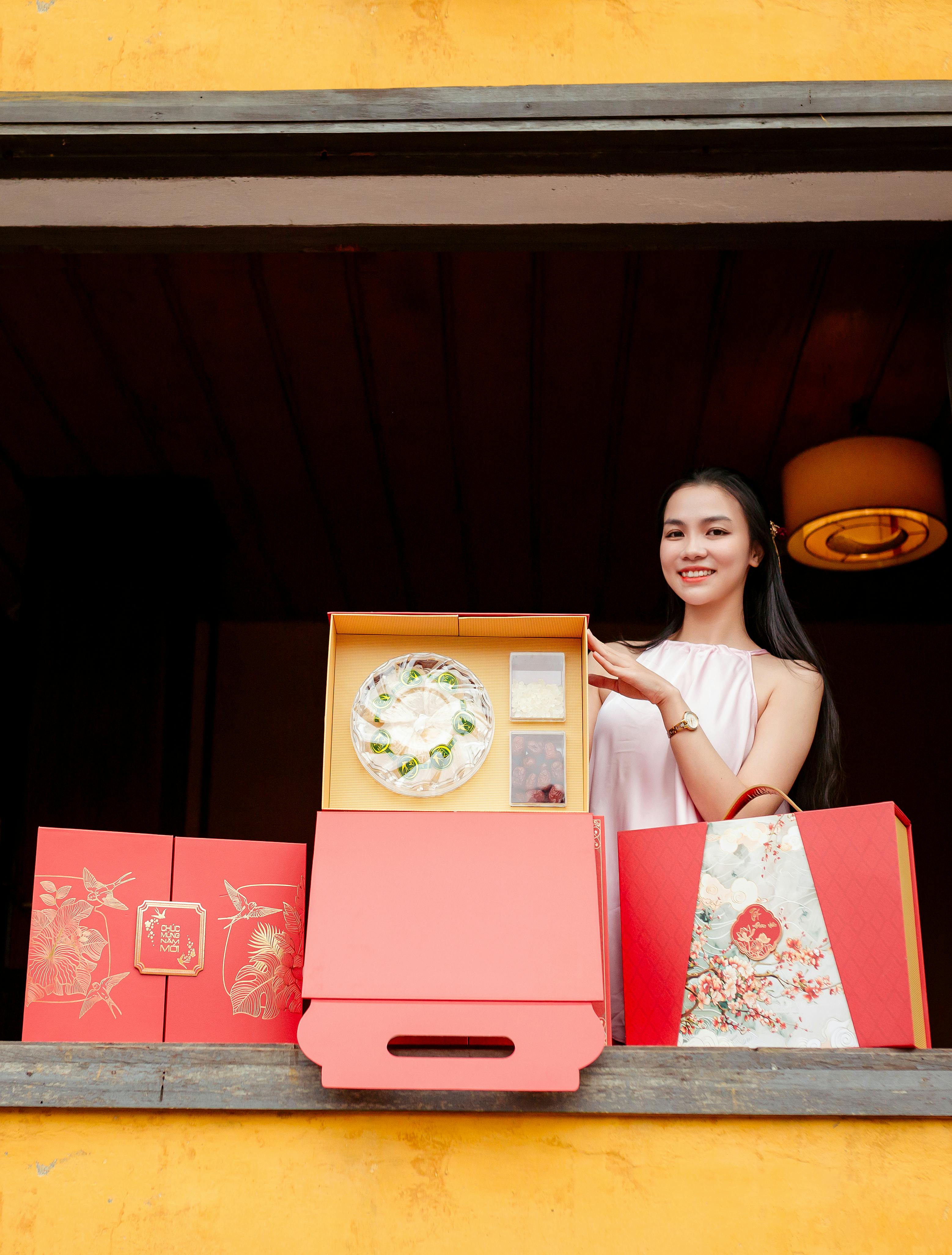 Traditional Vietnamese Woman with Gift Boxes in Hội An · Free Stock Photo