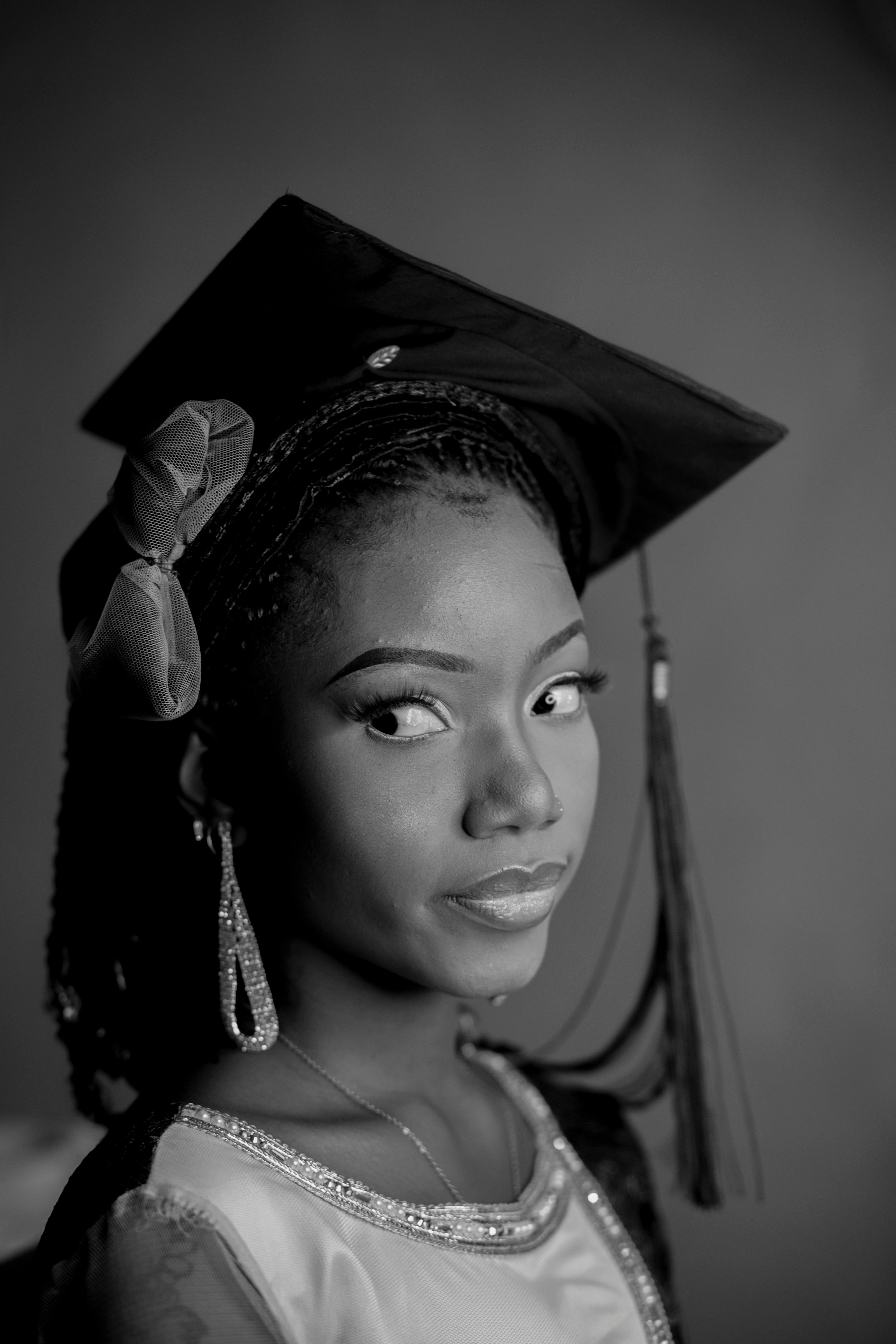 Portrait of a Young Graduate in Cap and Gown · Free Stock Photo