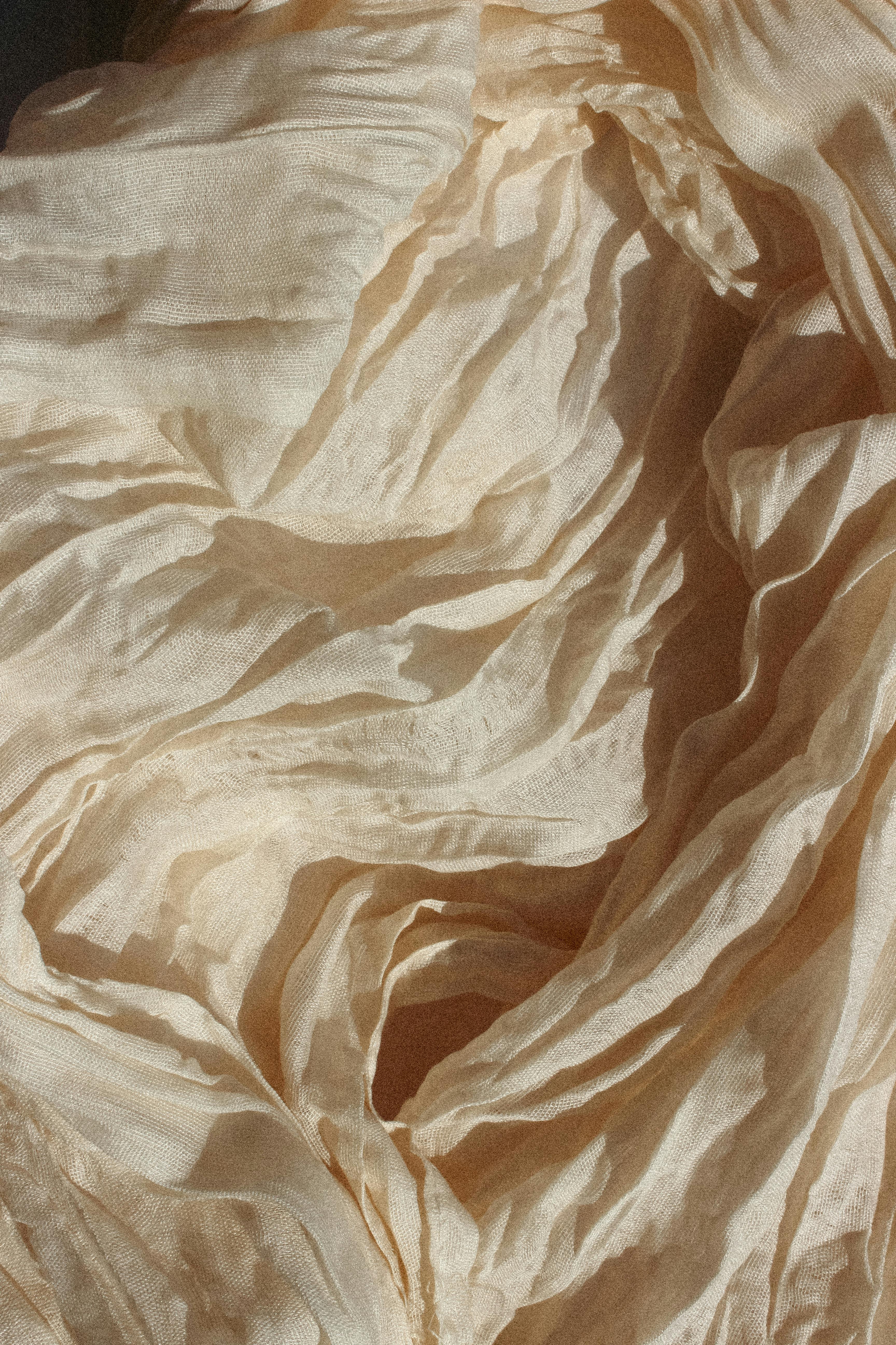Textured Beige Fabric with Natural Light Shadows · Free Stock Photo