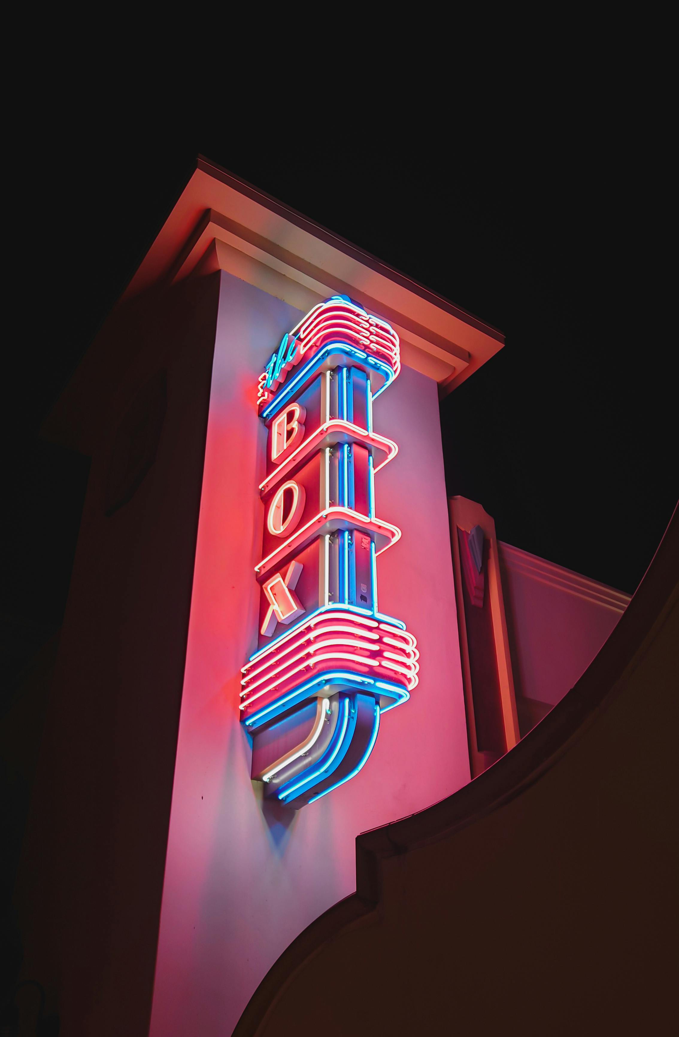 Vibrant Neon Box Sign at Night in Riverside · Free Stock Photo
