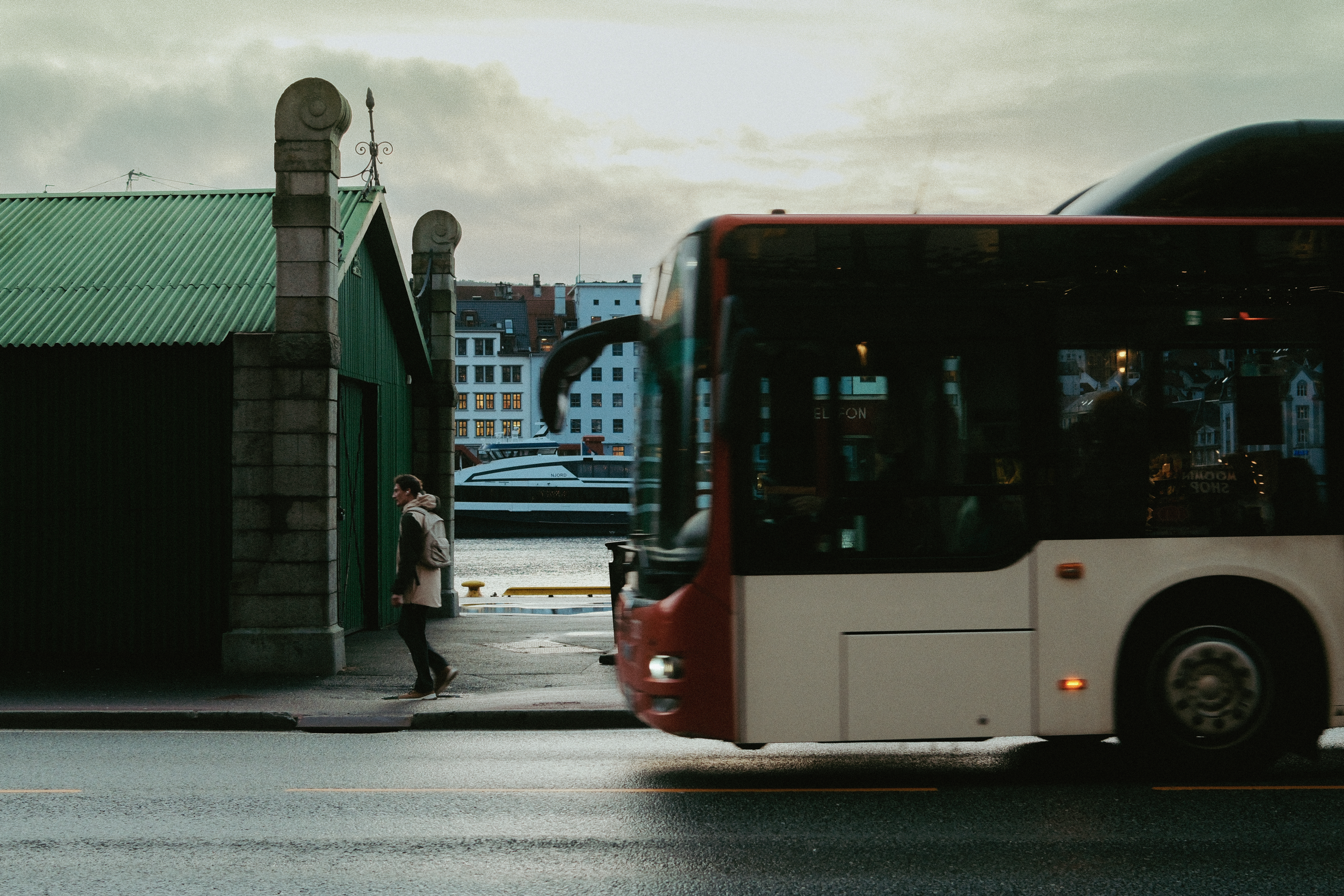 City Street Scene with Moving Bus and Pedestrian · Free Stock Photo
