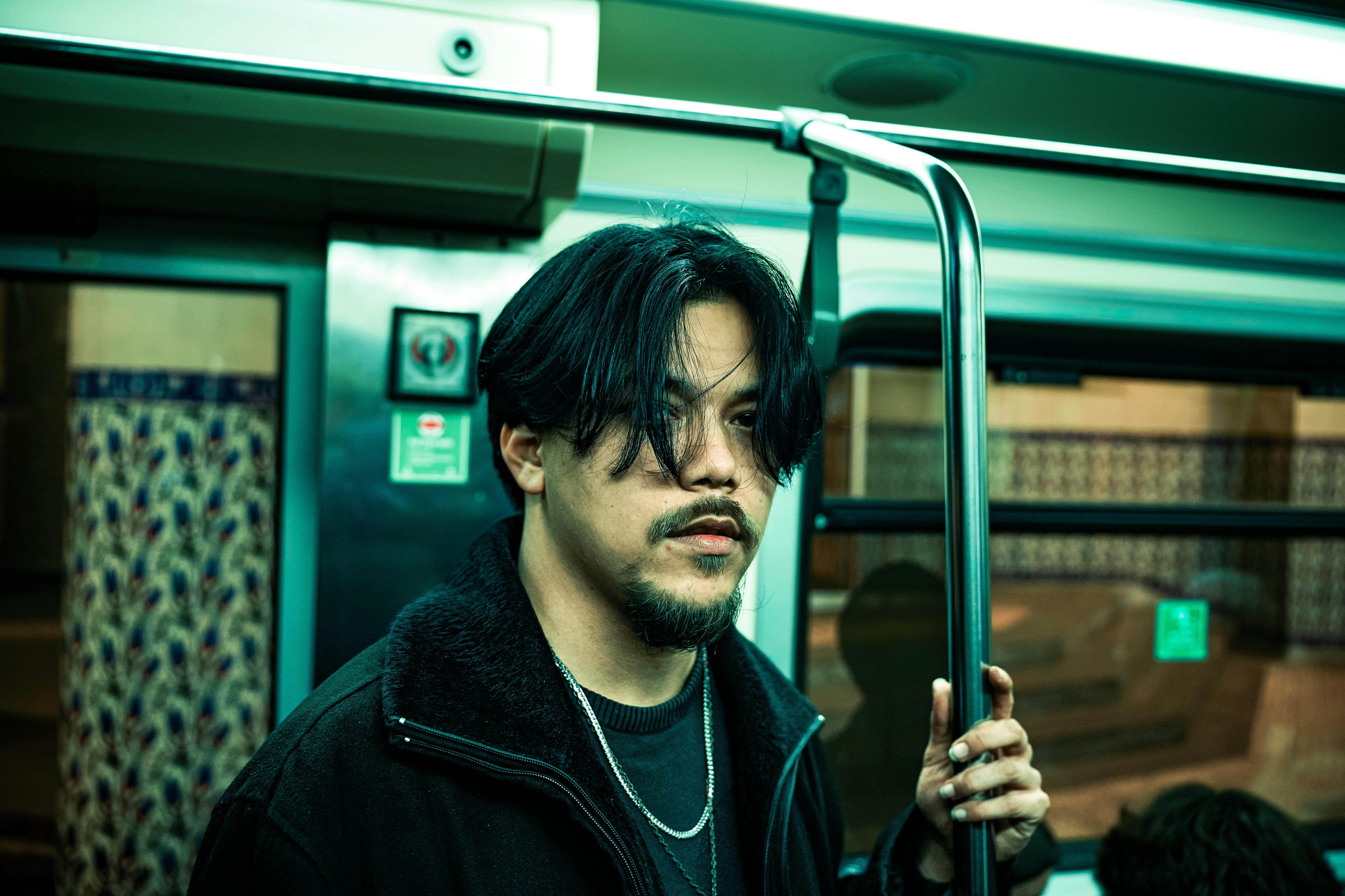 Young Man Riding Subway Train Interior Scene · Free Stock Photo