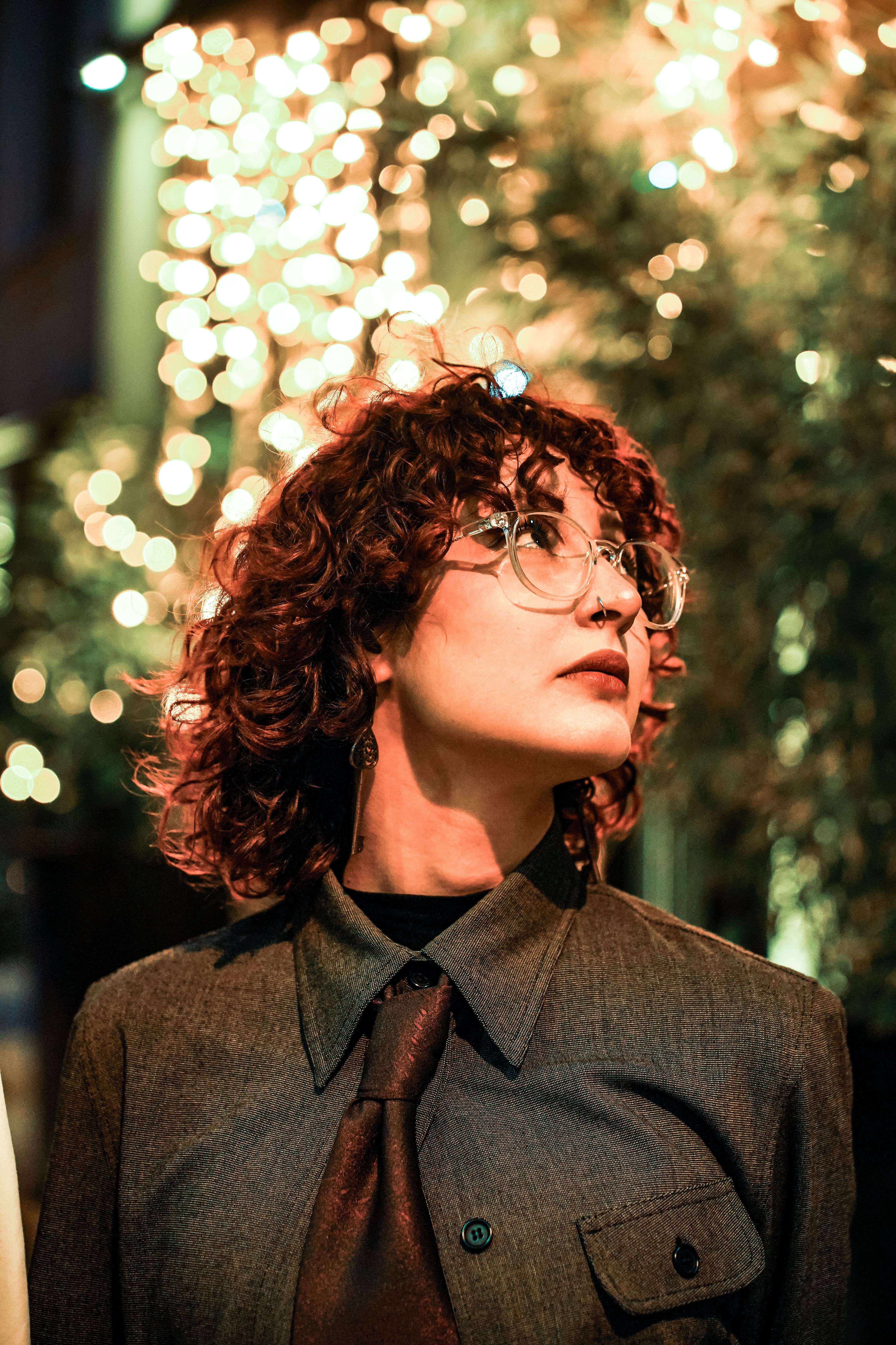 Portrait of Woman with Curly Hair and Glasses at Night · Free Stock Photo