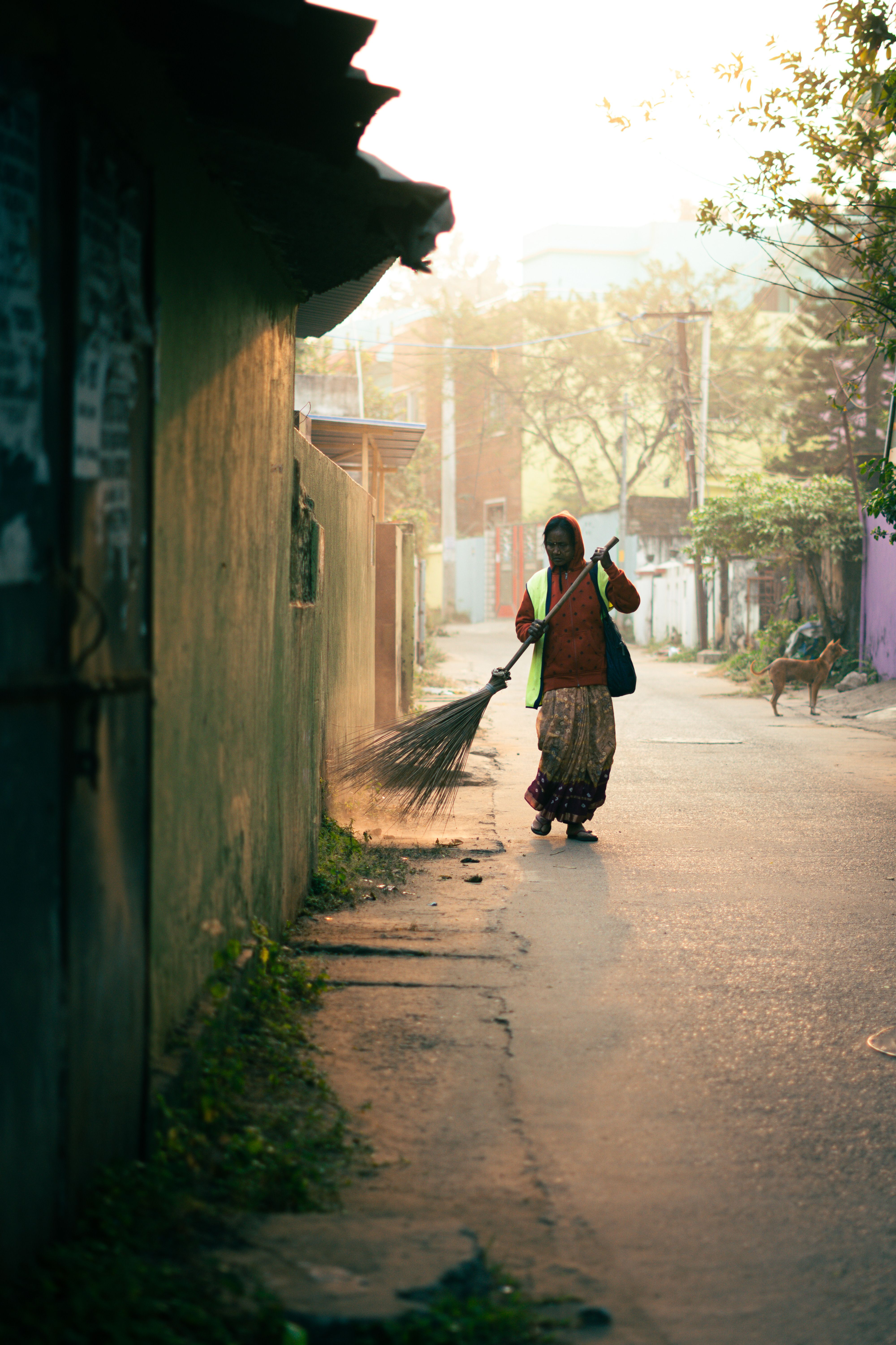 Street Cleaner Sweeping in Sunrise Light · Free Stock Photo