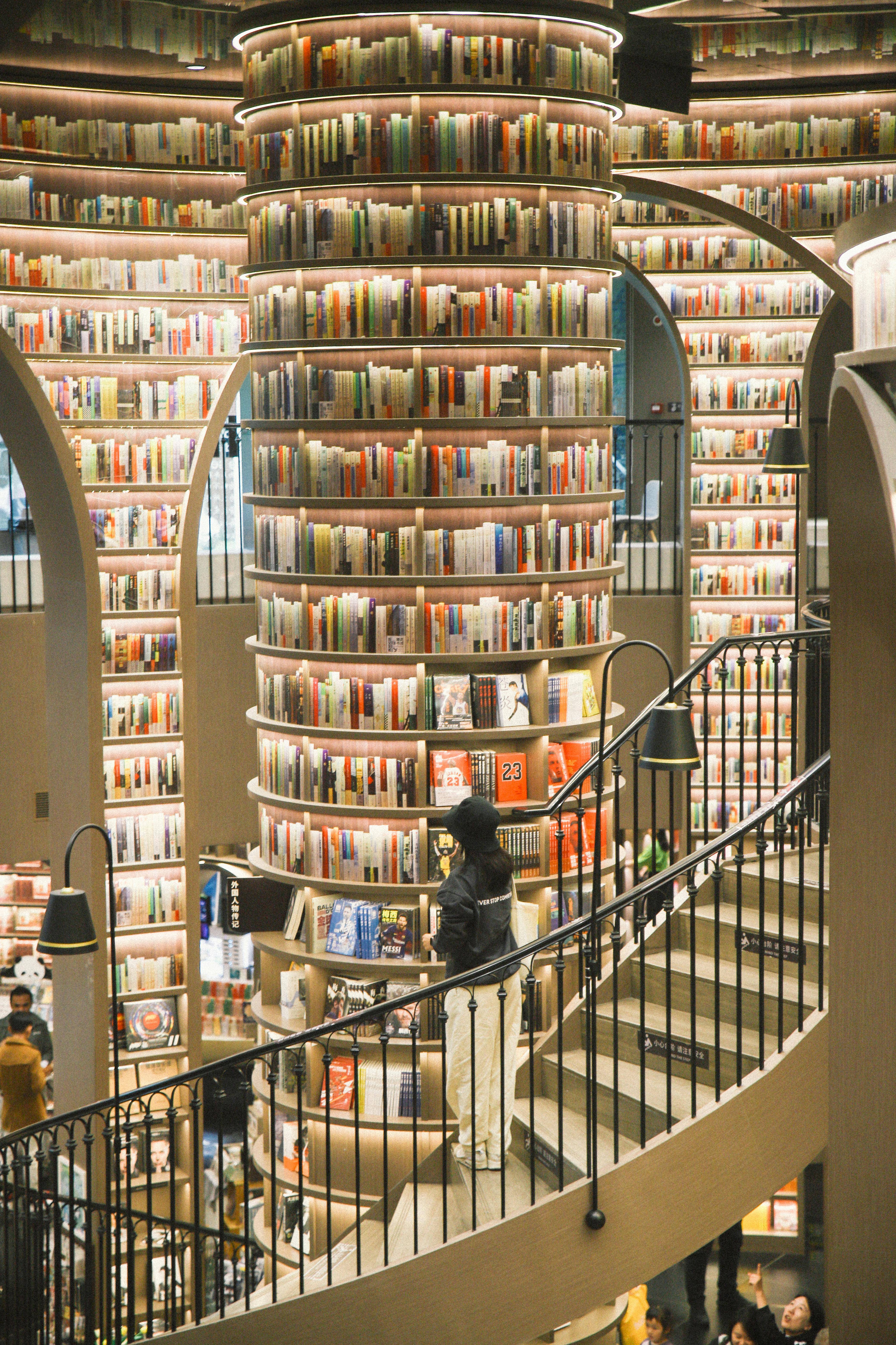 Modern Spiral Library Interior with Visitors · Free Stock Photo