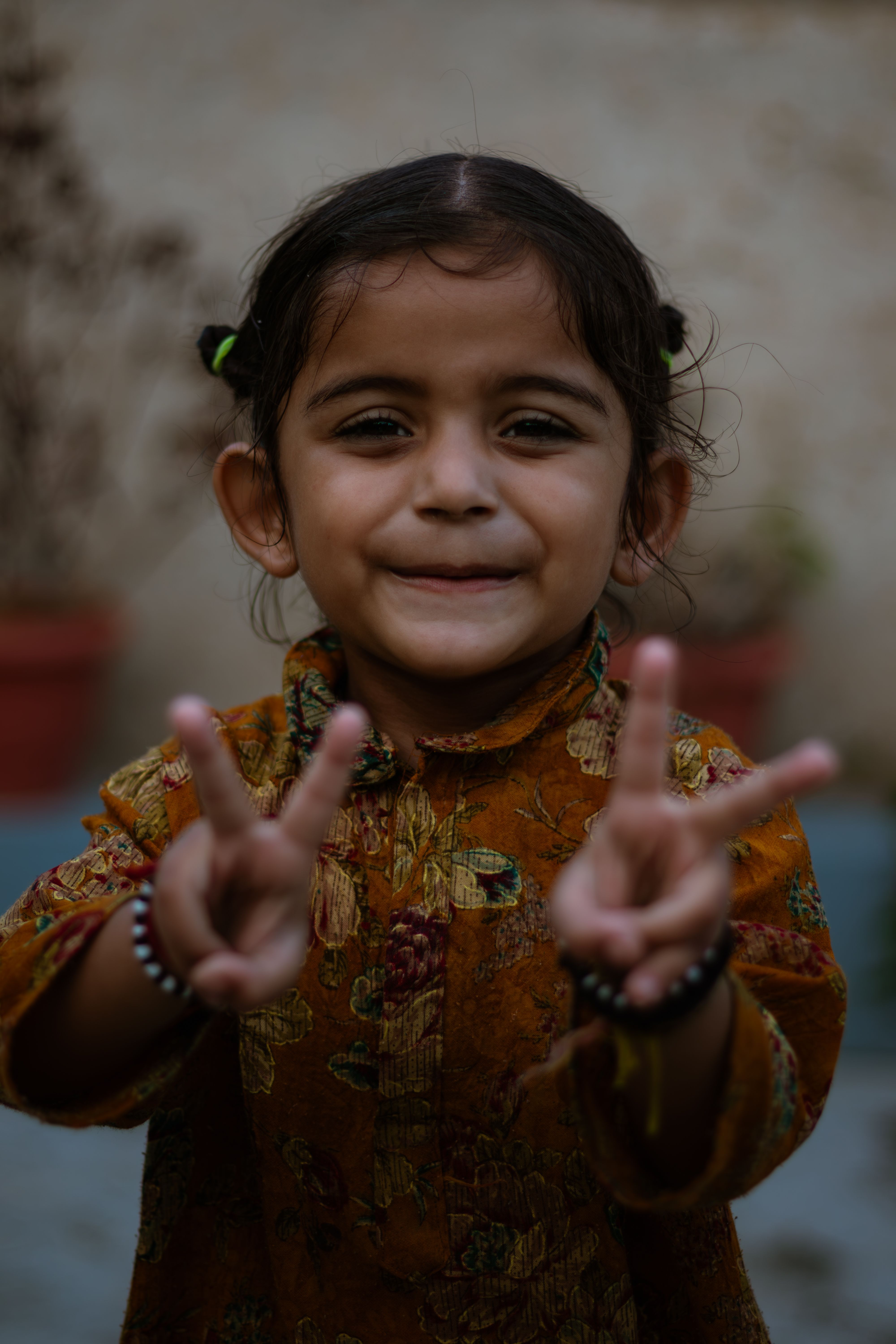 Joyful Child Making Peace Signs in India · Free Stock Photo
