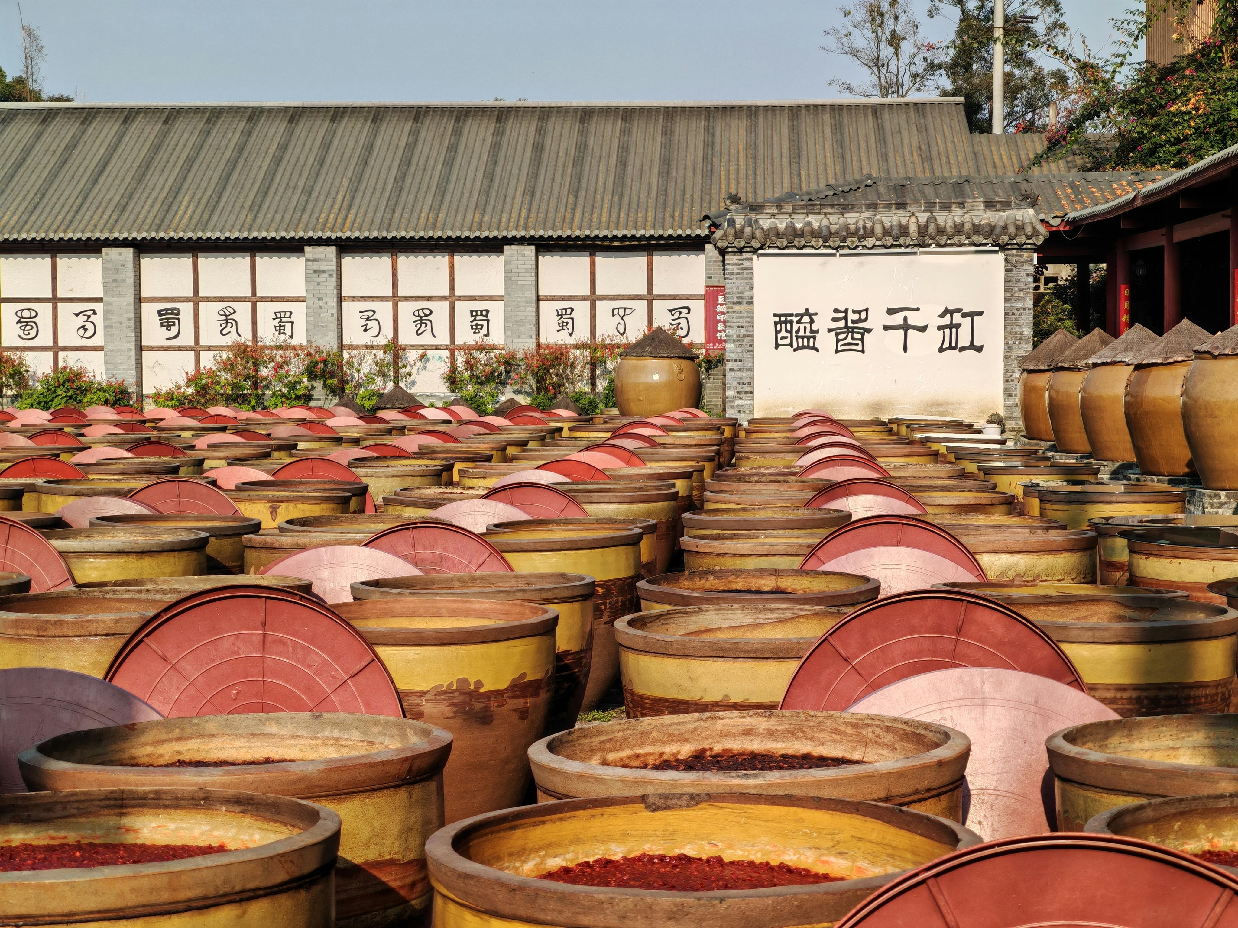 Traditional Chinese Fermentation Jars in Courtyard · Free Stock Photo