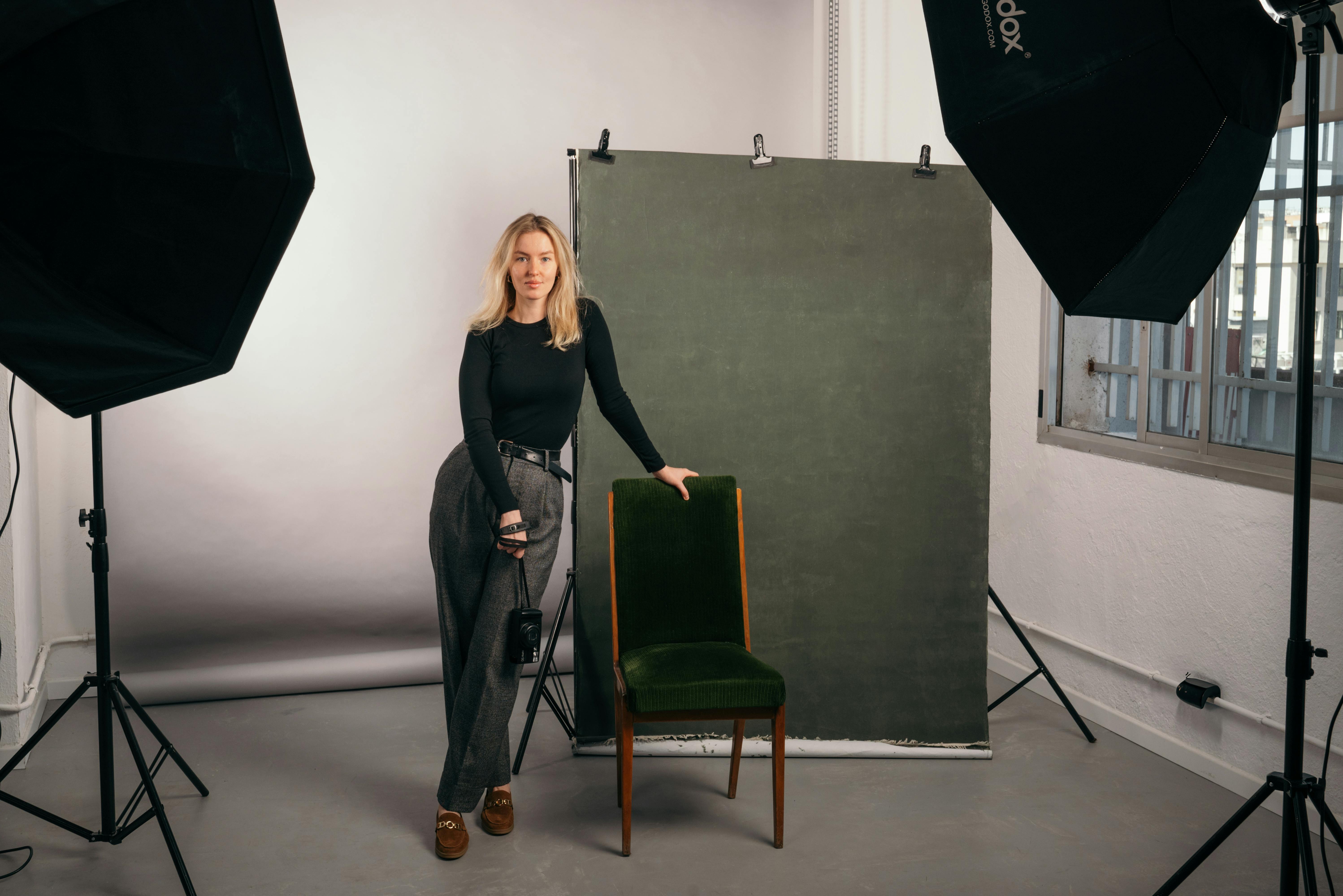 Portrait Photographer in Studio with Equipment · Free Stock Photo