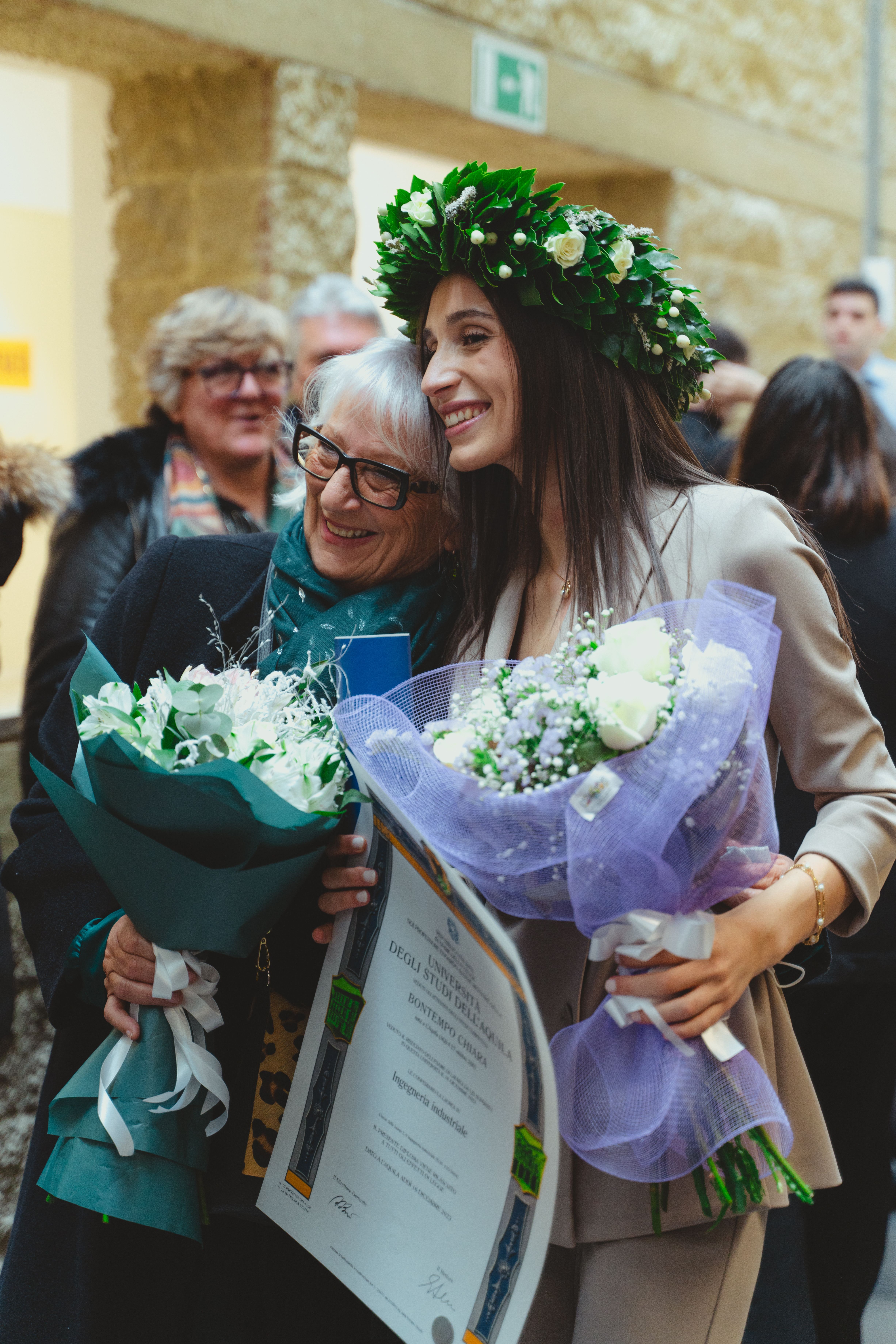 Joyful Graduation Celebration with Graduate and Family · Free Stock Photo