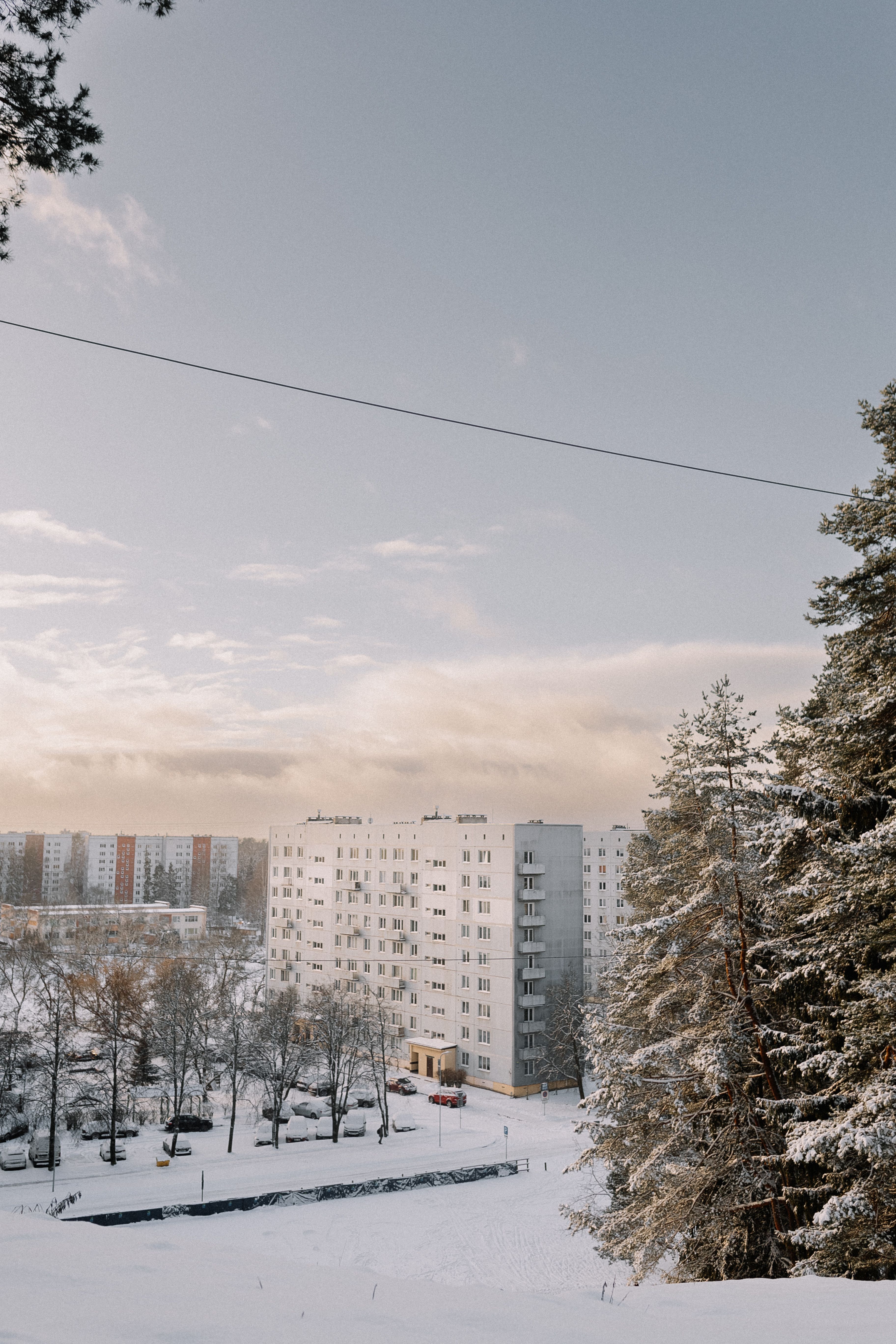 Wintery Cityscape with Snowy Apartment Buildings · Free Stock Photo