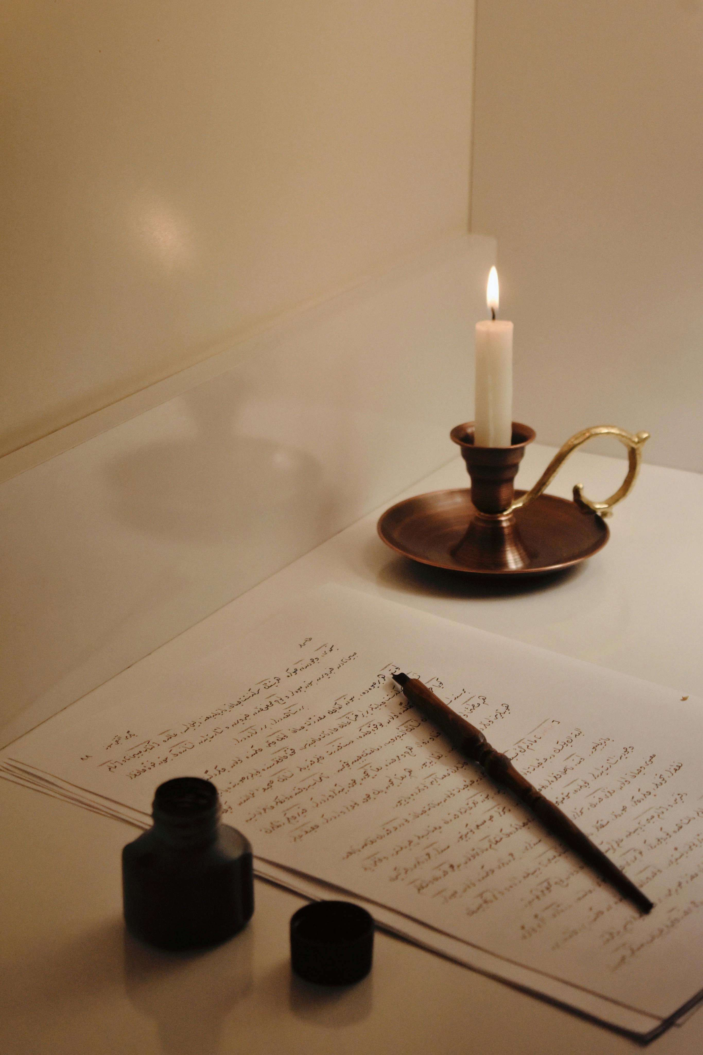 Cozy Candlelit Writing Desk with Quill and Ink · Free Stock Photo