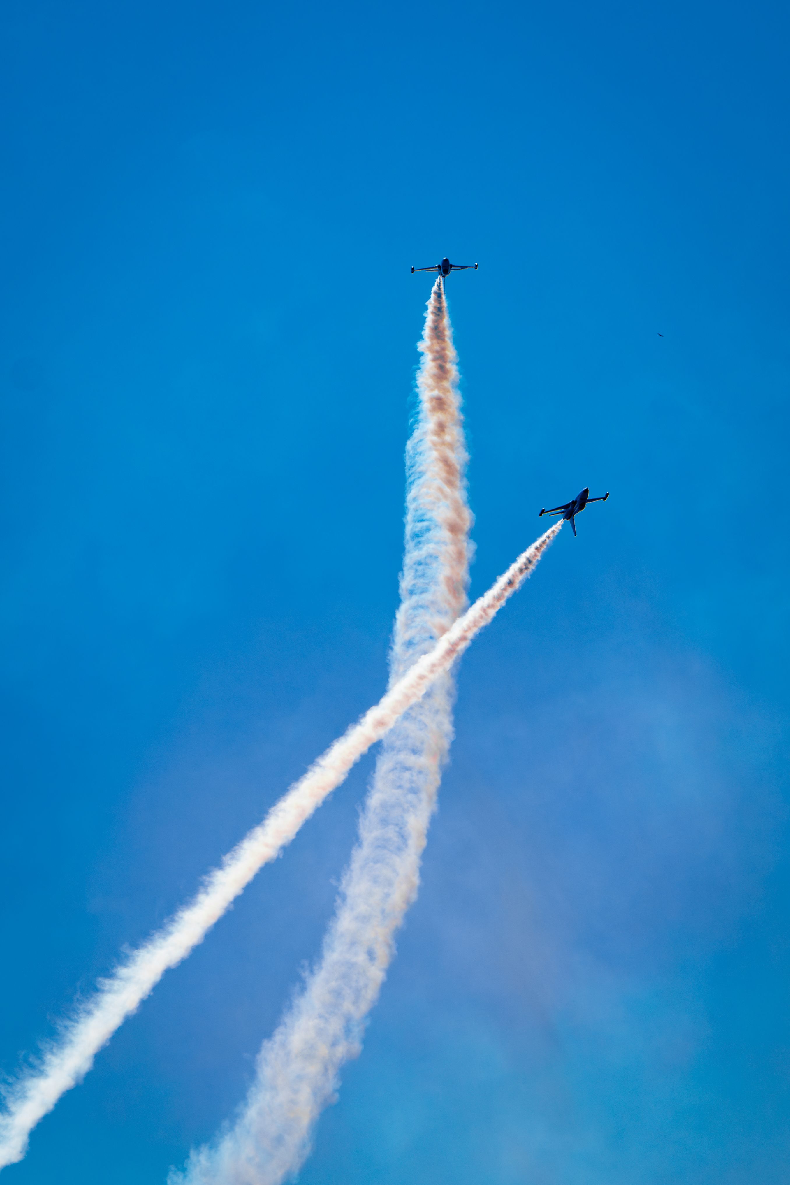 High-Flying Aerobatic Jet Performance in Blue Sky · Free Stock Photo