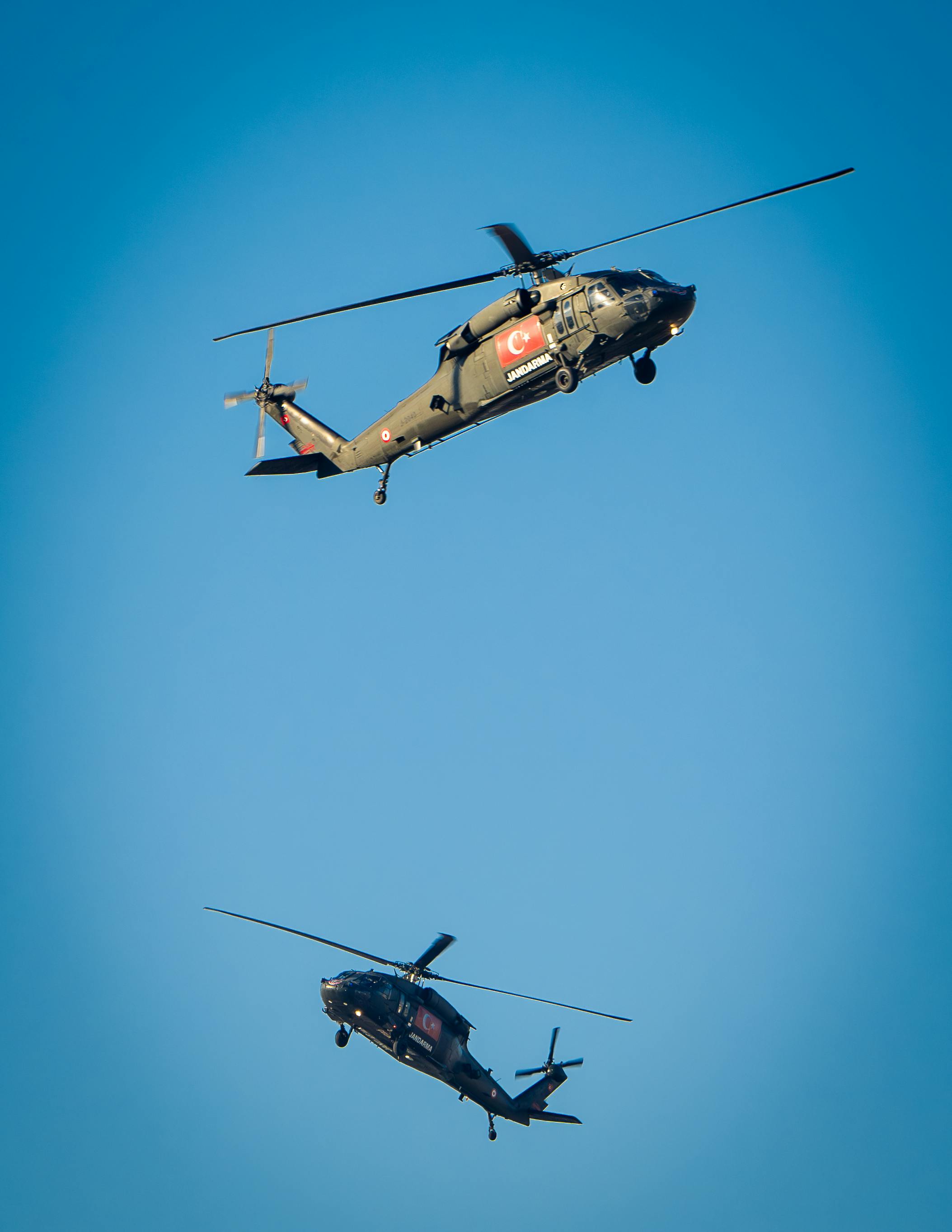 Military Helicopters in Formation Against Blue Sky · Free Stock Photo