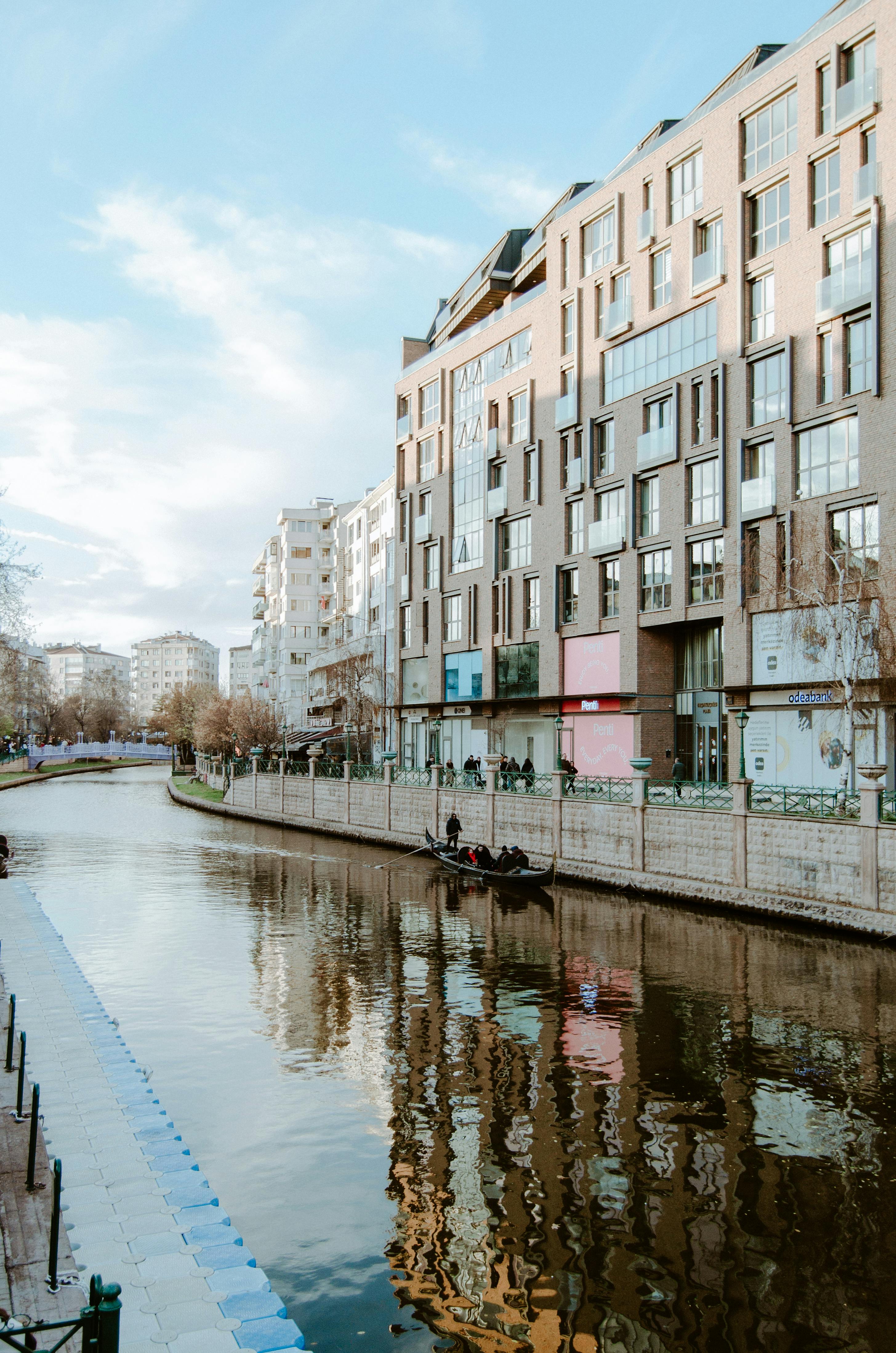 Urban Canal with Modern Architecture Reflections · Free Stock Photo