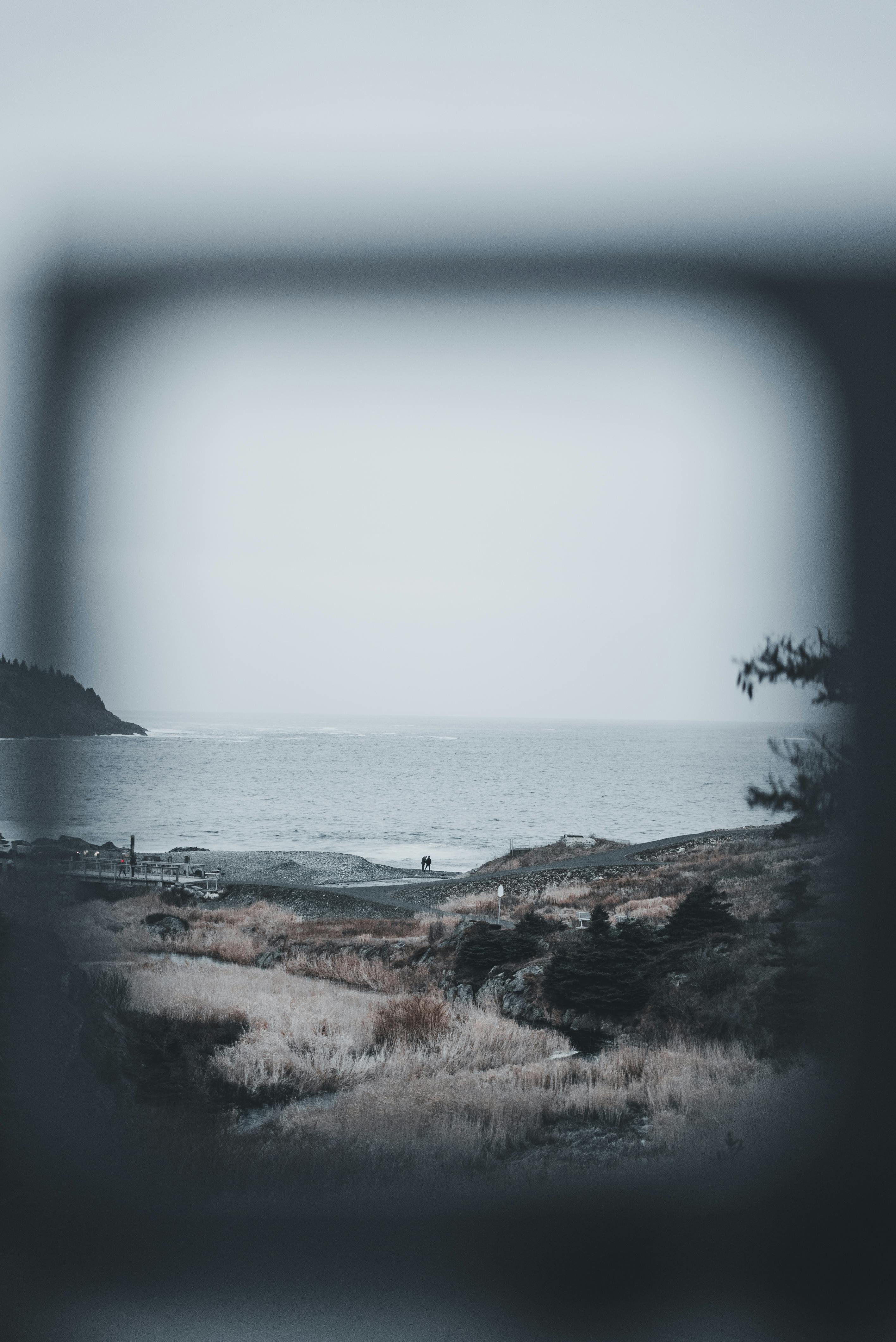 Scenic Coastal View Through Window Frame · Free Stock Photo