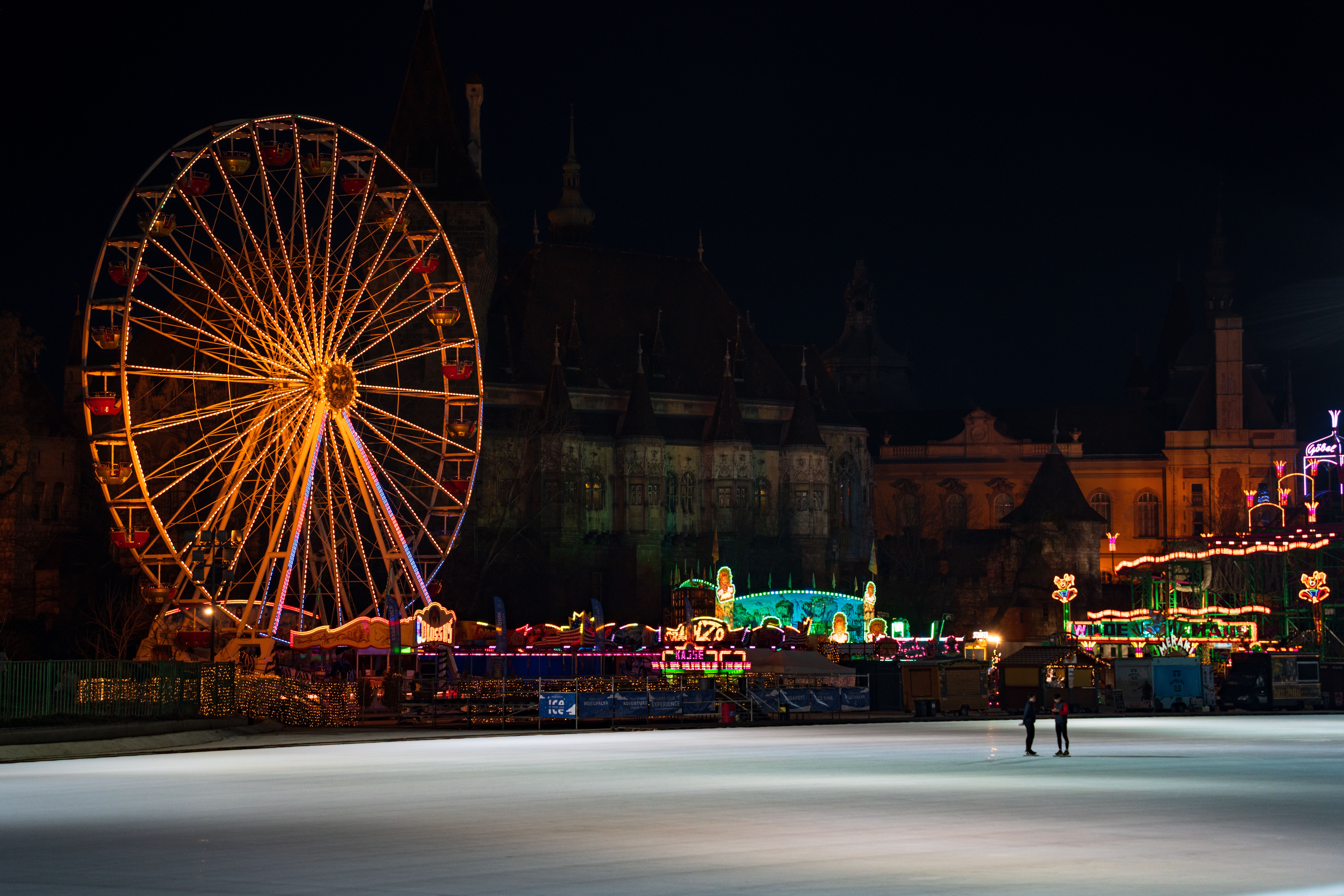 Nighttime Ice Skating by Illuminated Ferris Wheel in Budapest · Free ...