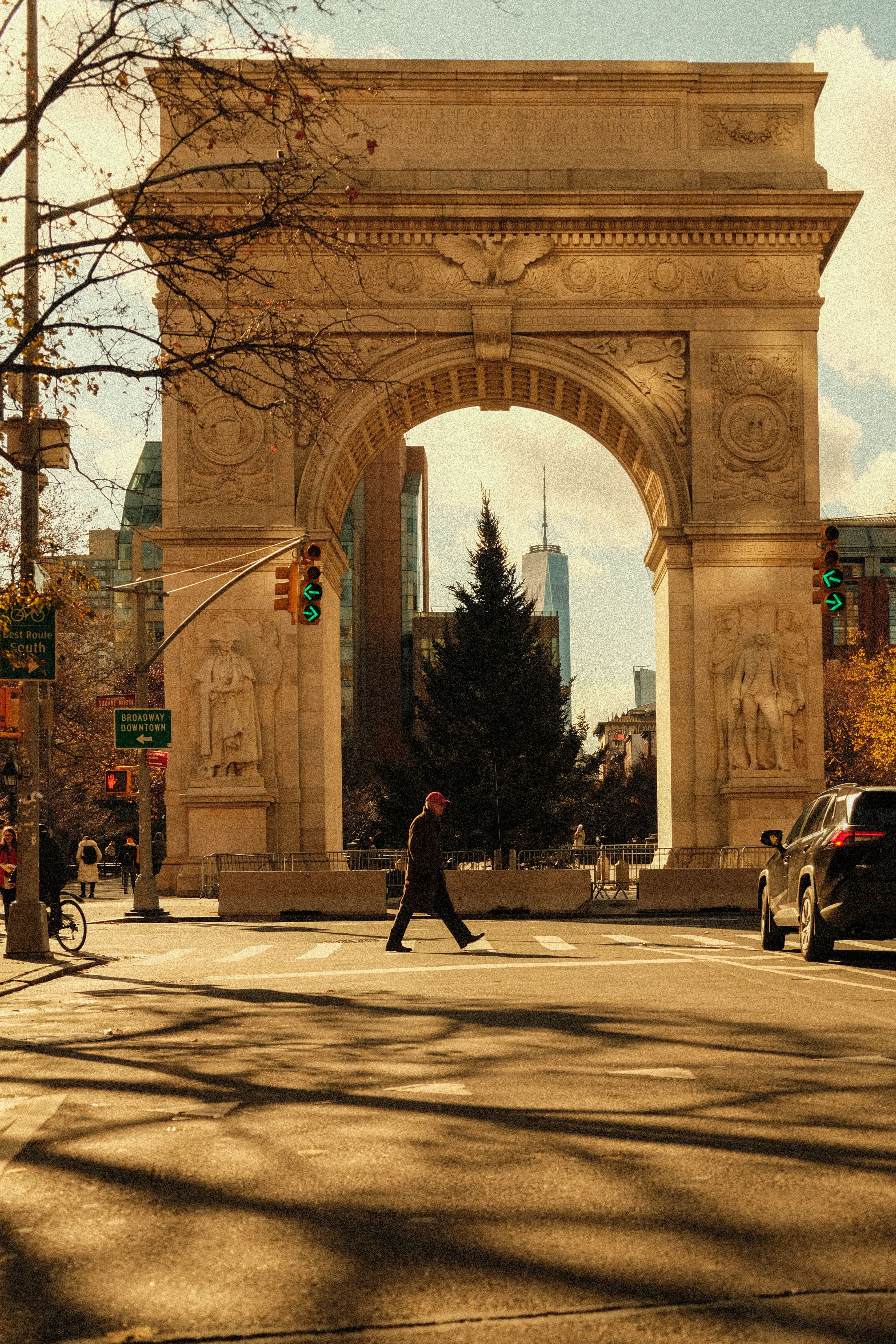 Man Walking Across Famous Archway in Cityscape · Free Stock Photo