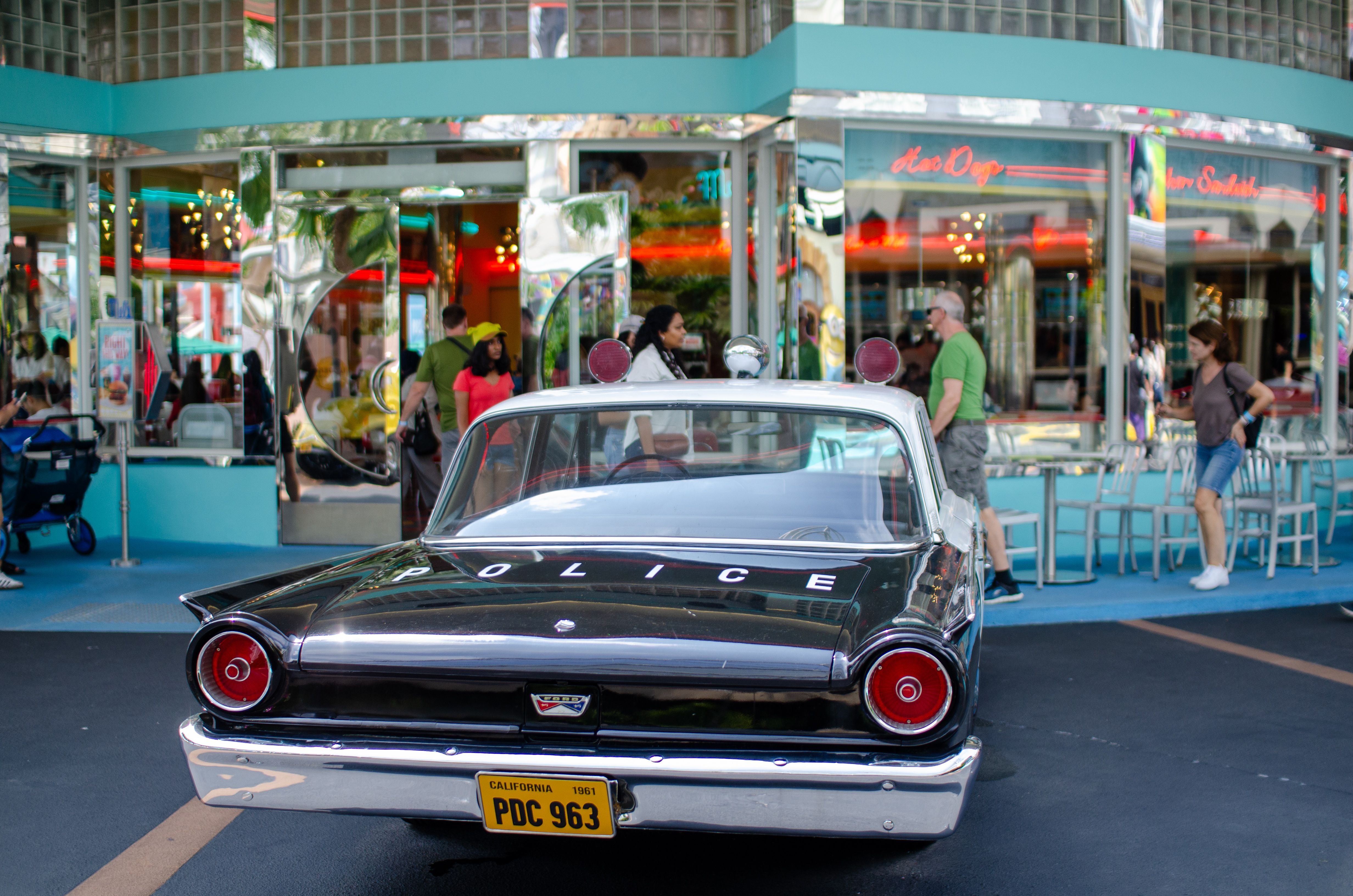 Vintage Police Car Outside Retro Diner · Free Stock Photo