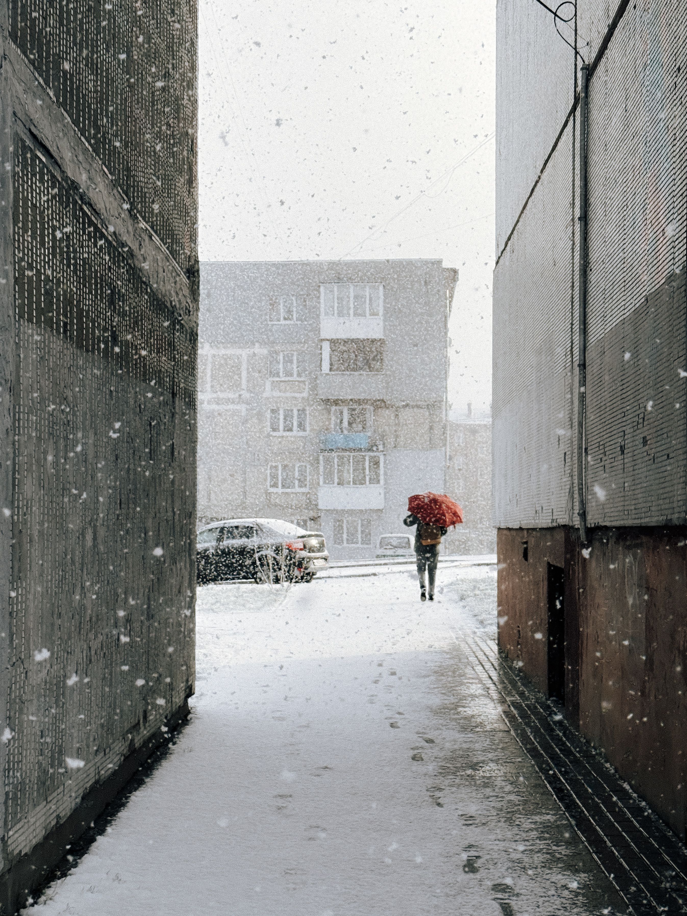 Person Walking Through Snowy Alley in Russia · Free Stock Photo